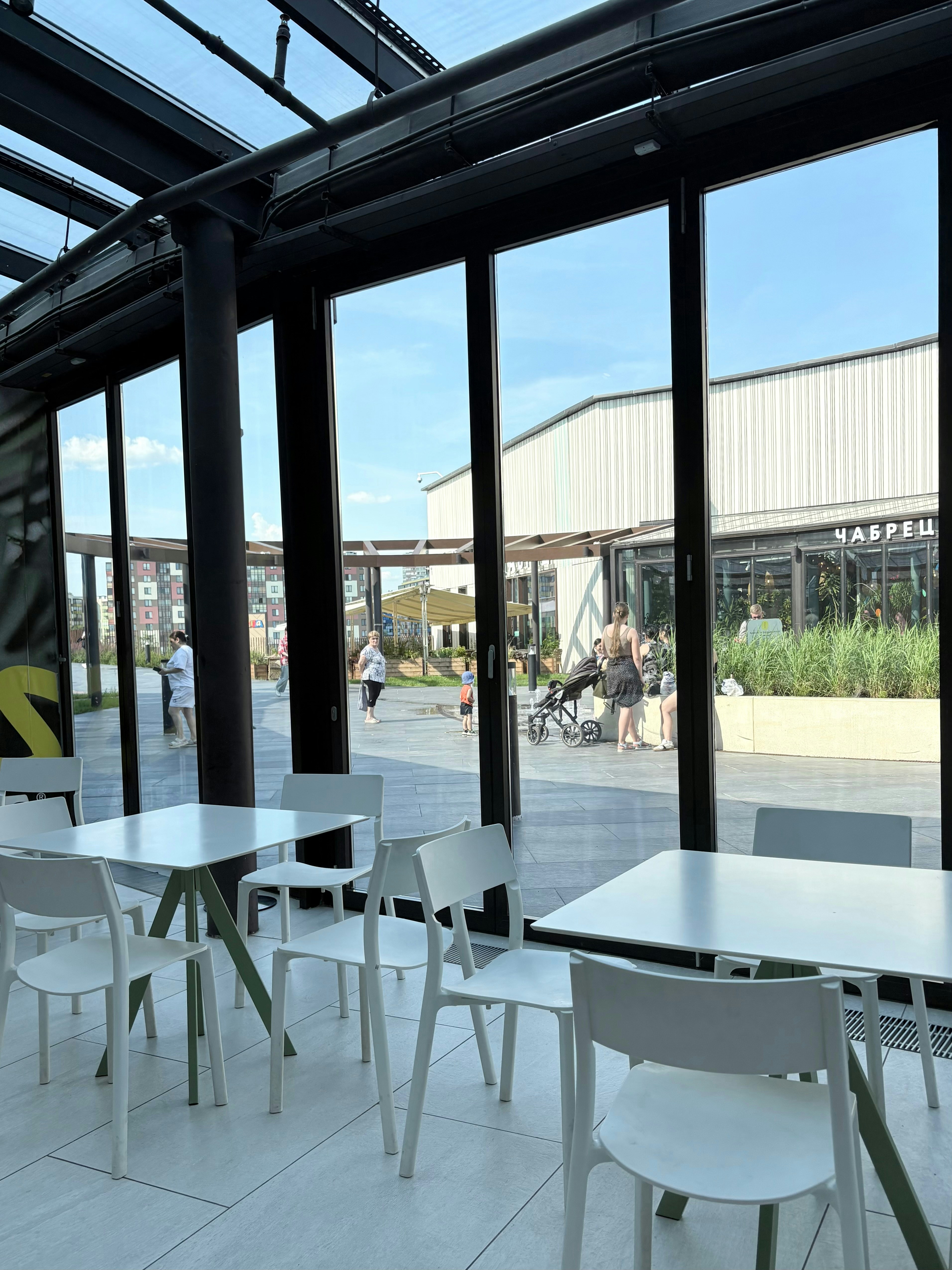 Inside view of a cafe, overlooking an outdoor area.
