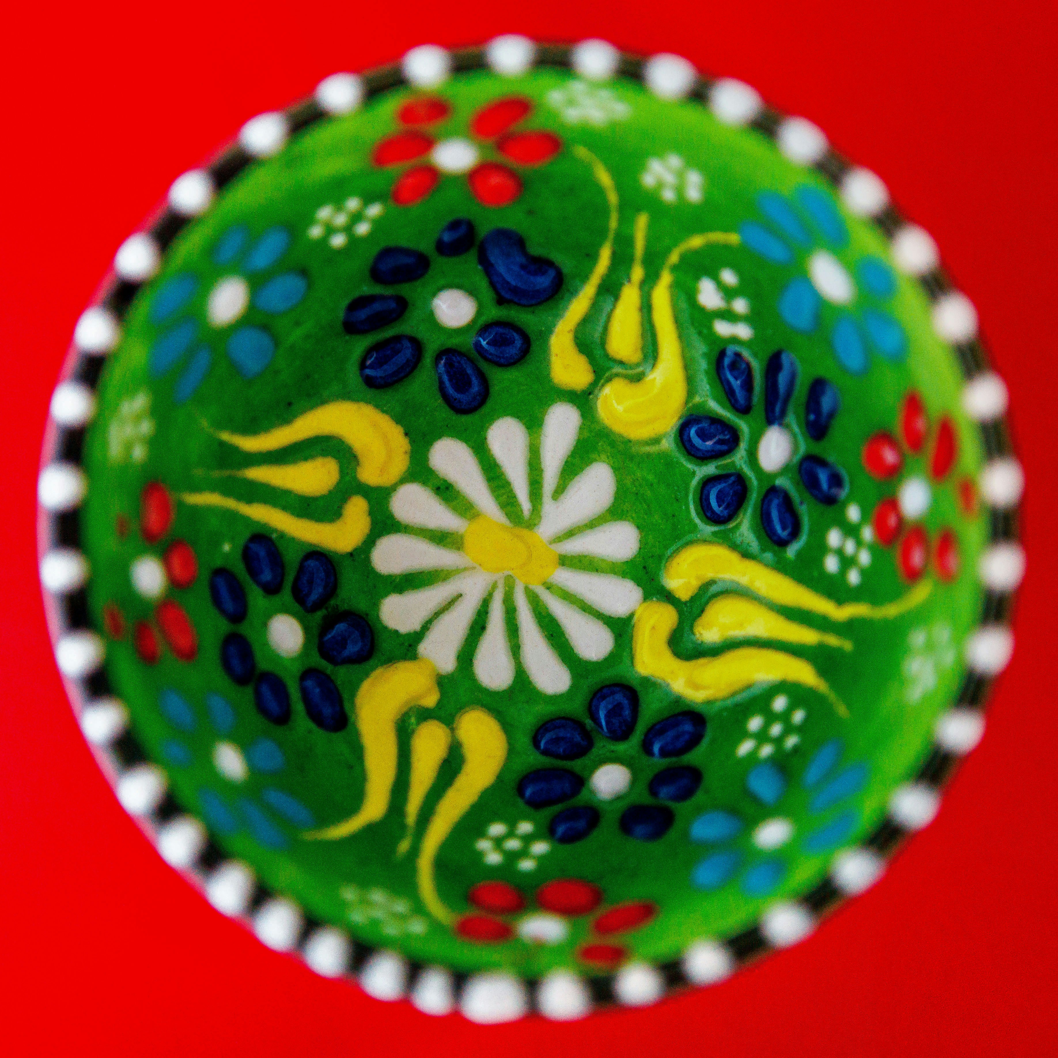 Decorated ceramic bowl with colorful floral patterns.