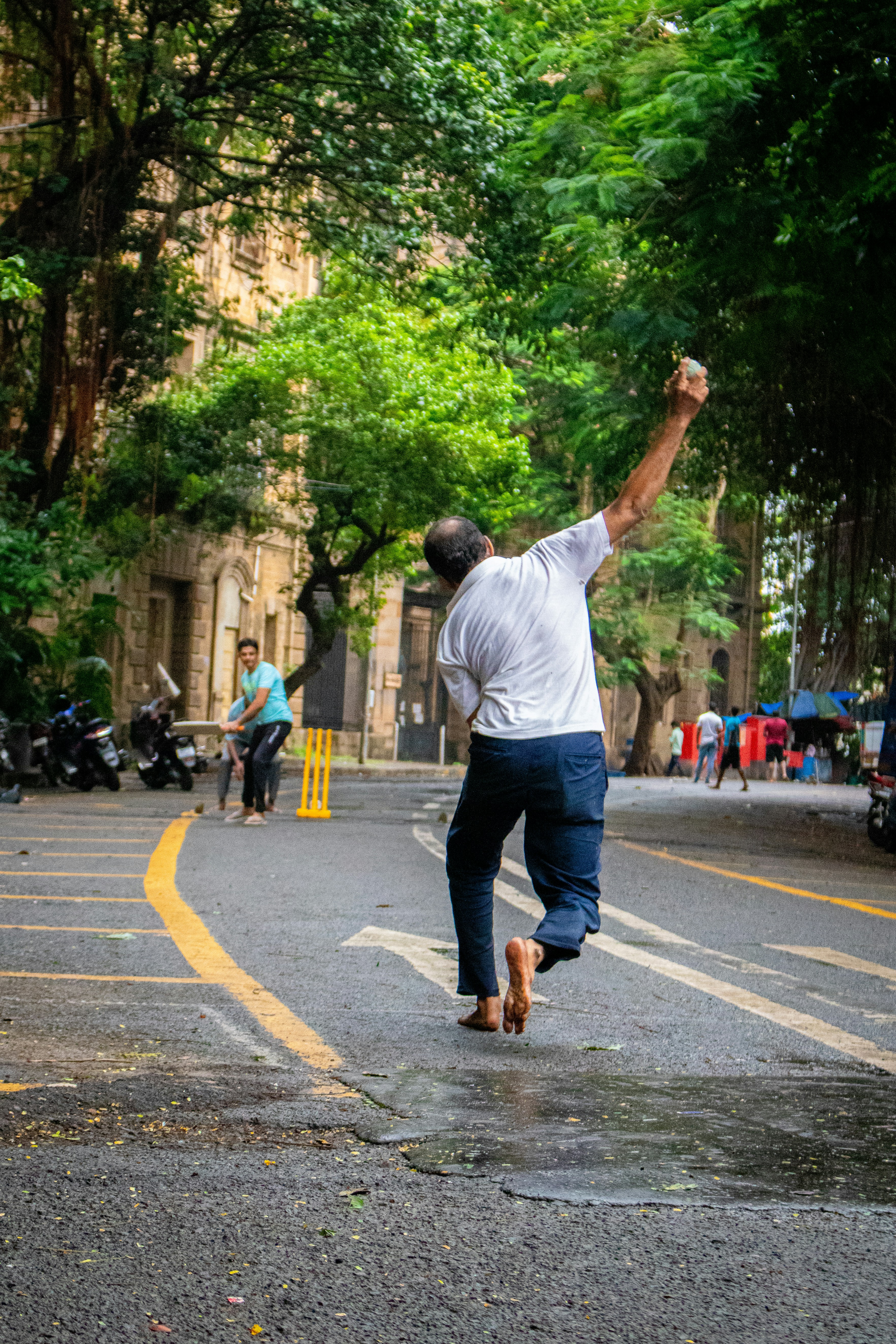 Mid-Stride Leap on a Rain-Washed Urban Street