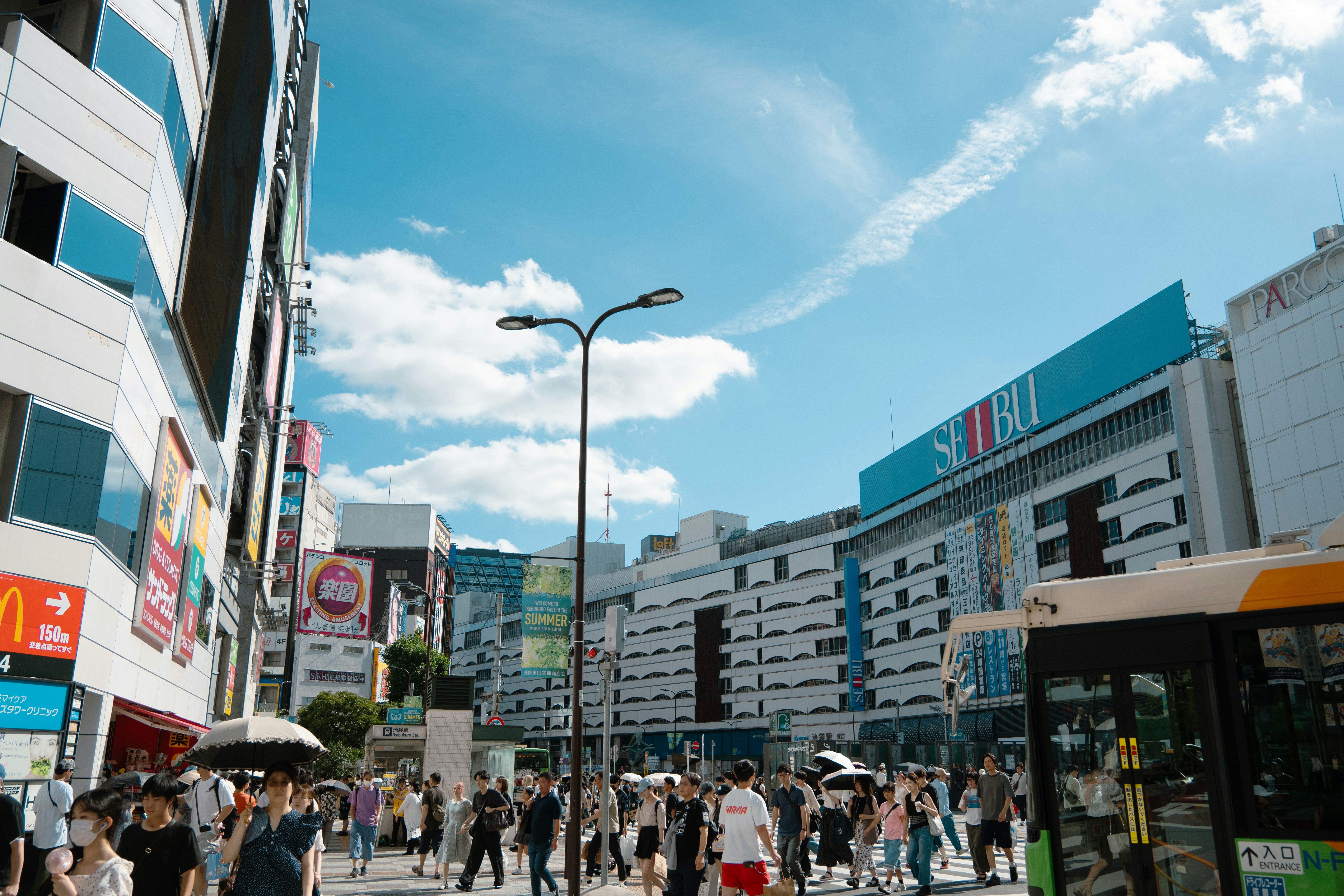 A busy city street with shops and people.