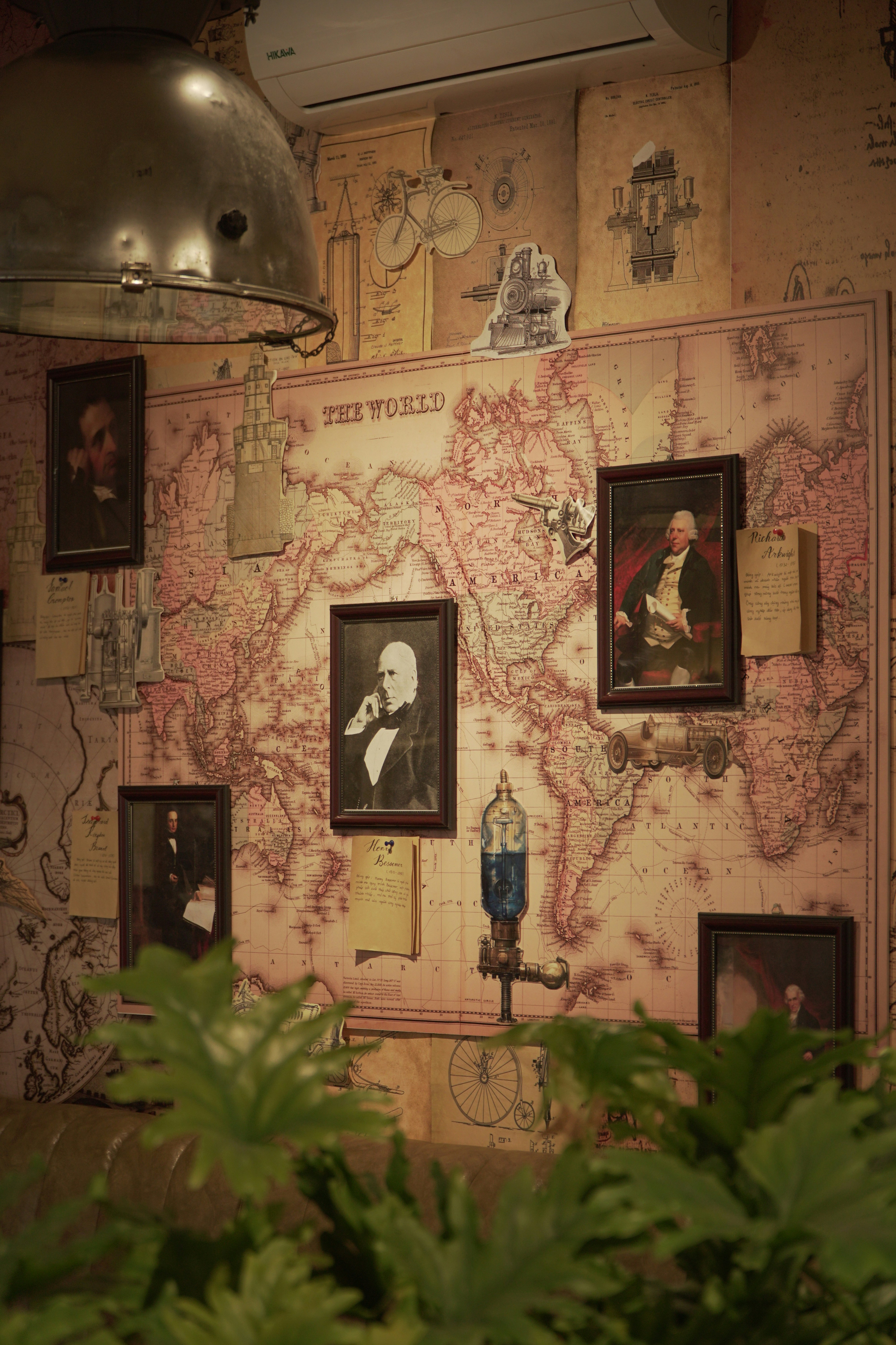 Heritage Wall: Portraits and Map in a Dimly Lit Atelier
