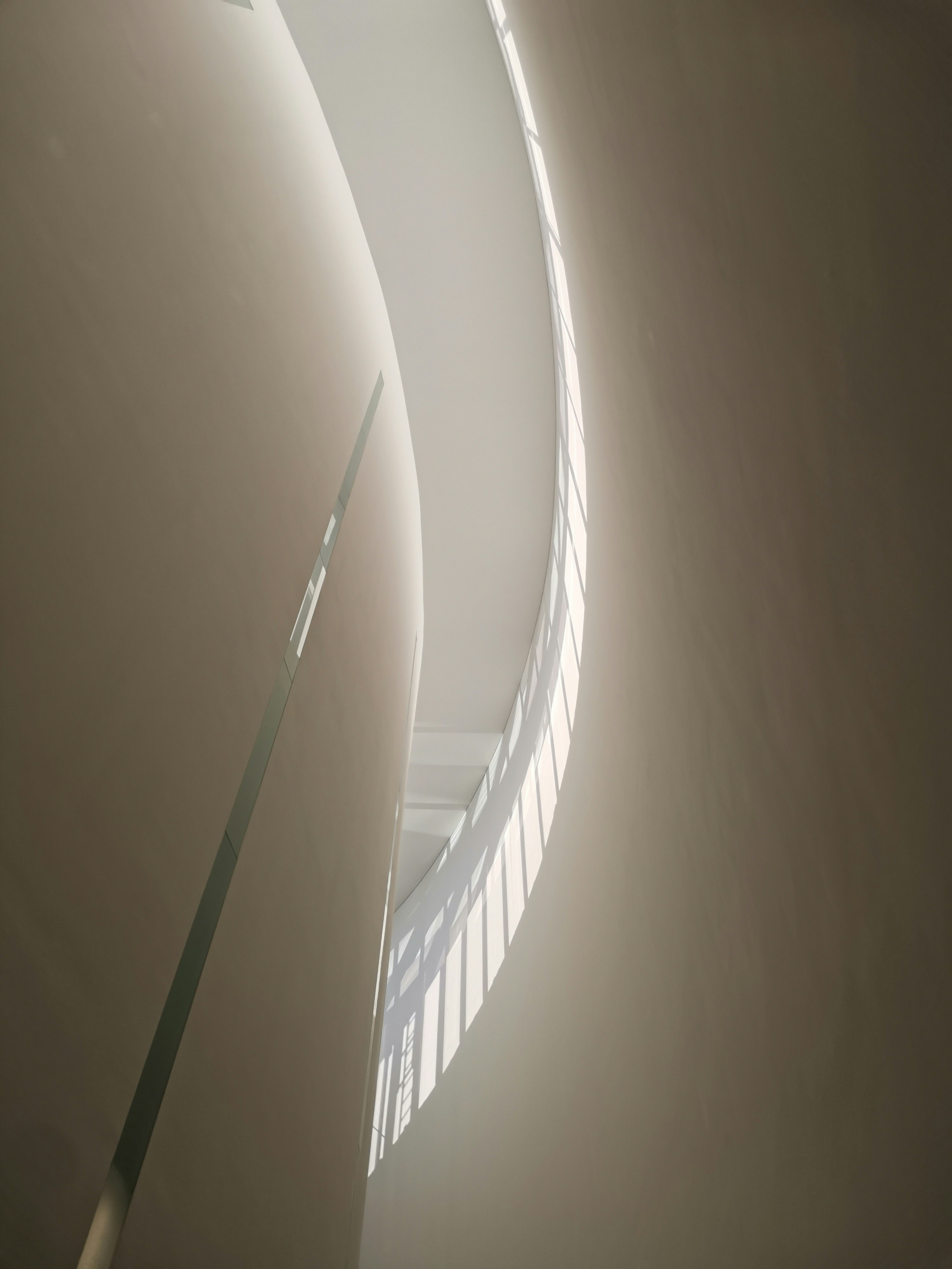 Curving architecture catches sunlight beautifully.