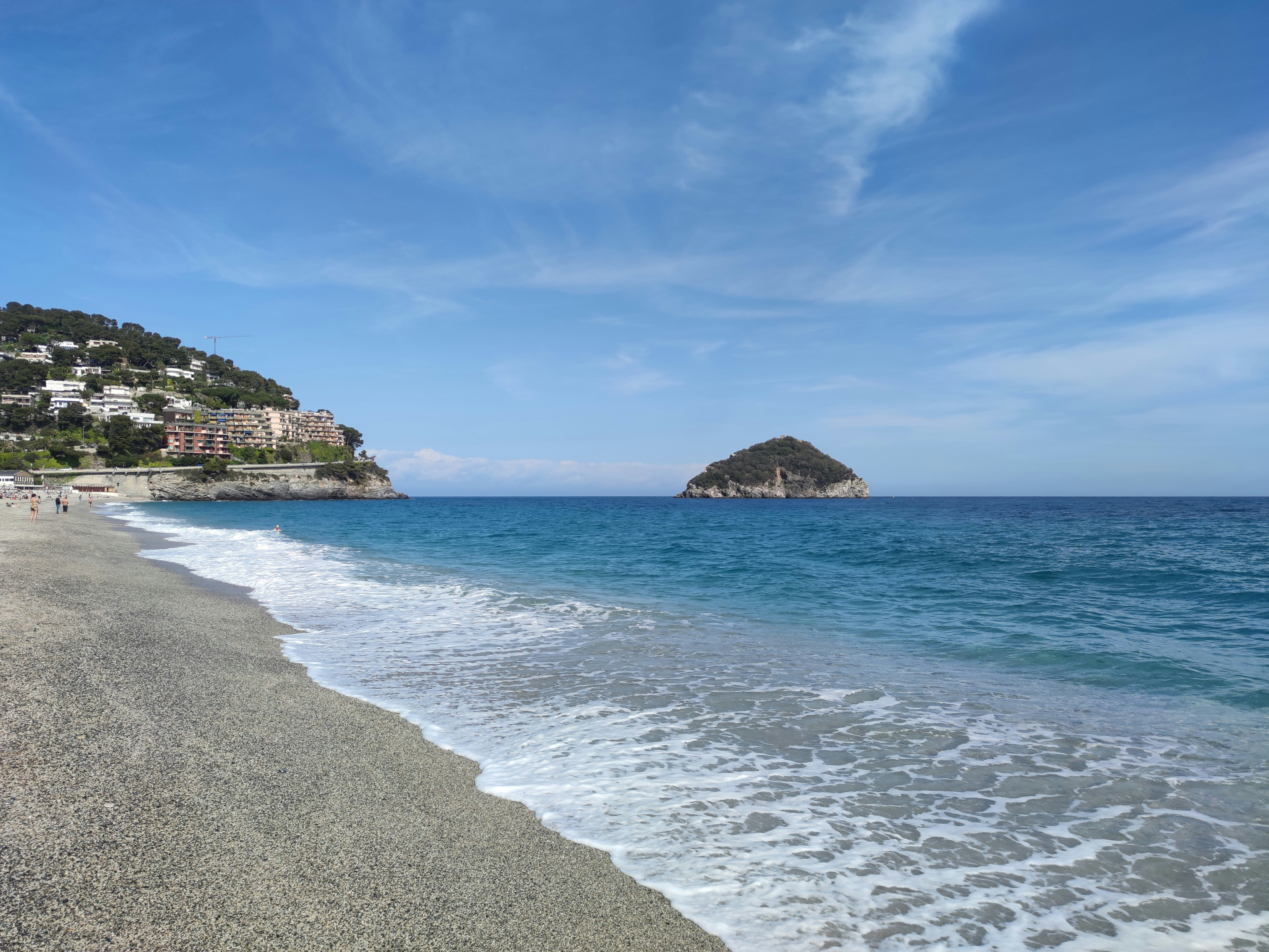 Spotorno ~ 25 April 2023 | Beach with clear water and a sunny blue sky.