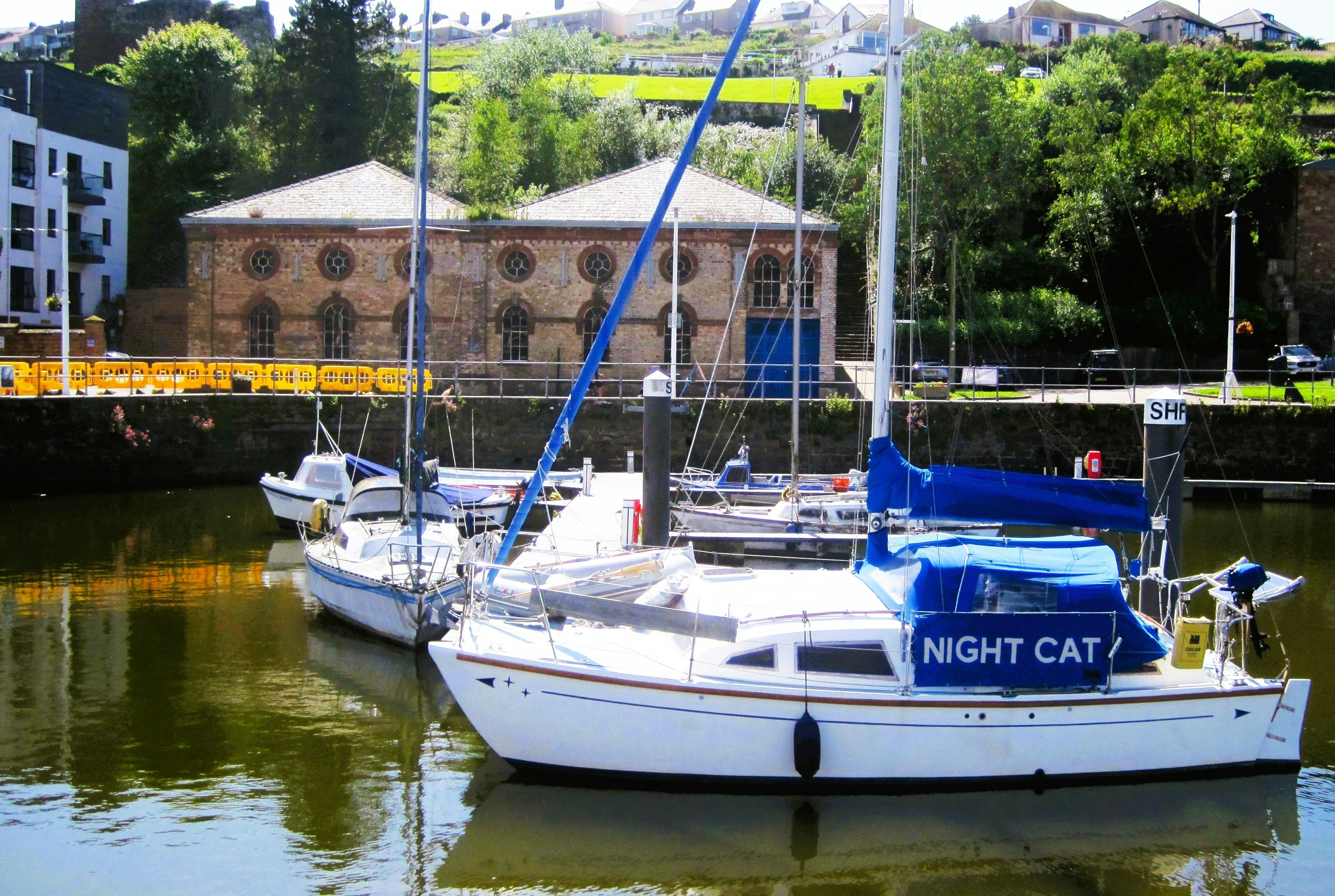 taken july 11th 2025 | Boats docked in a calm harbor.