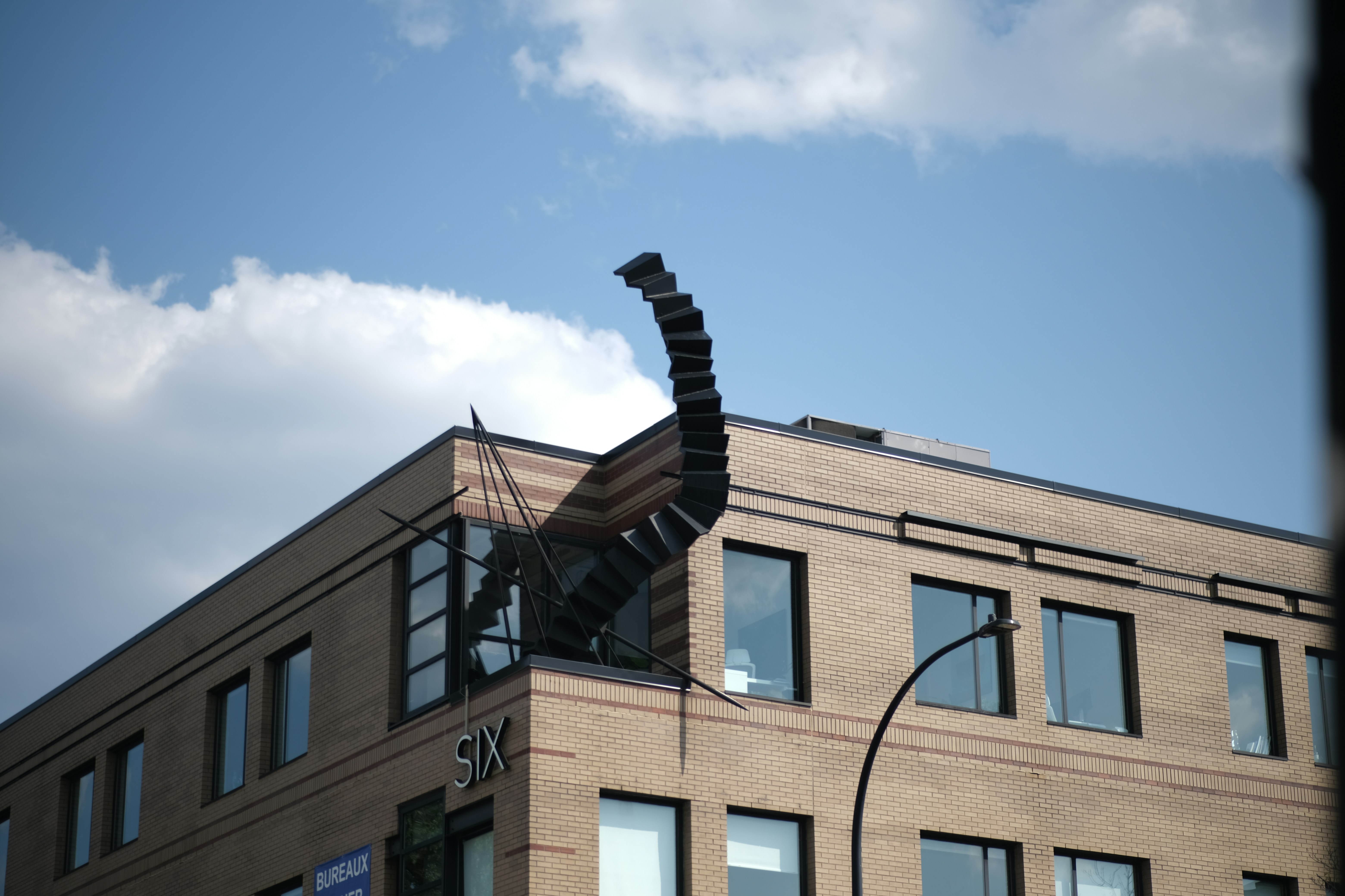 Spiral Staircase Crown on a Brick Office Block