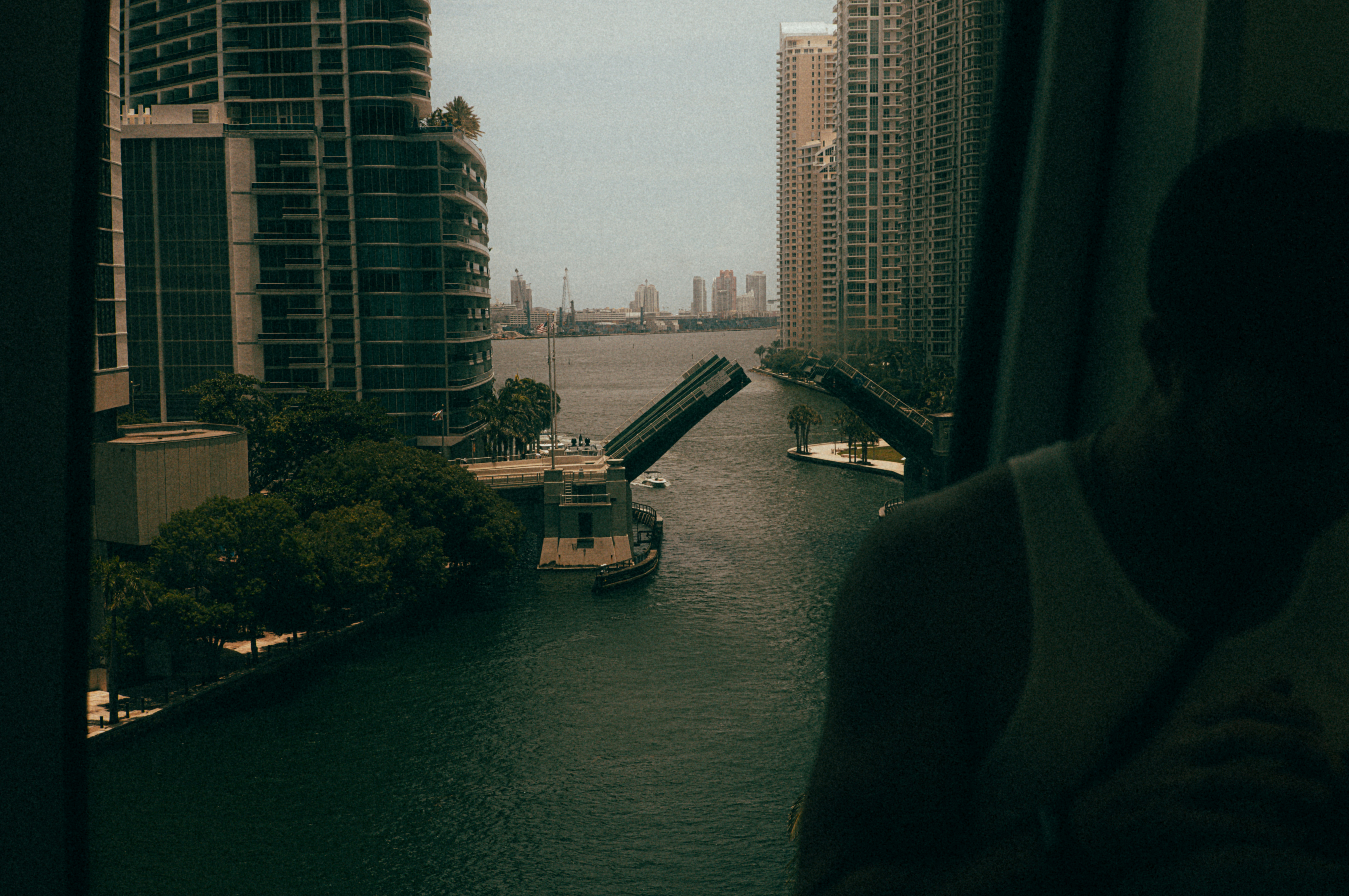 View of a city canal and a rising bridge.