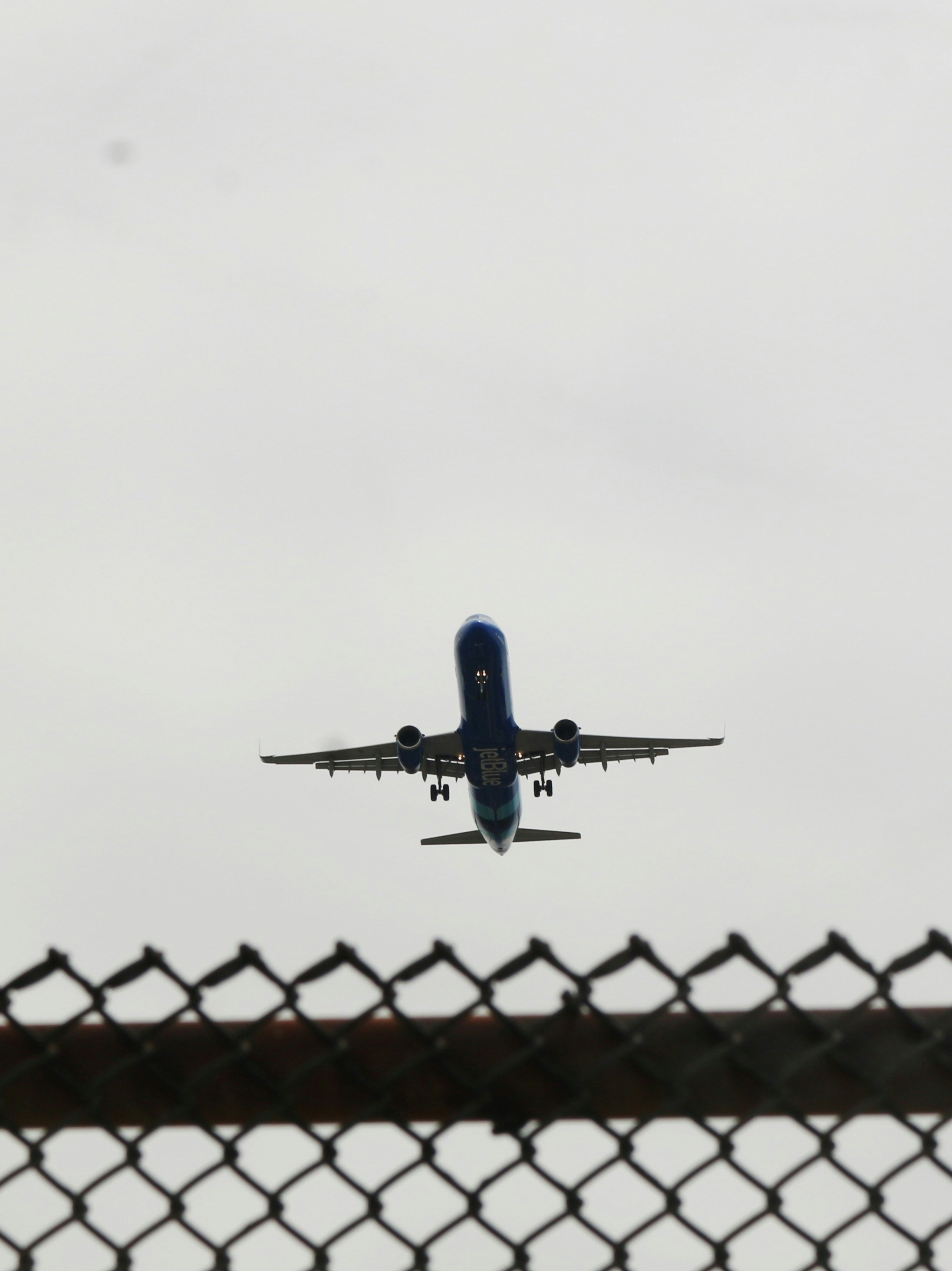 A plane is taking off, seen from below.