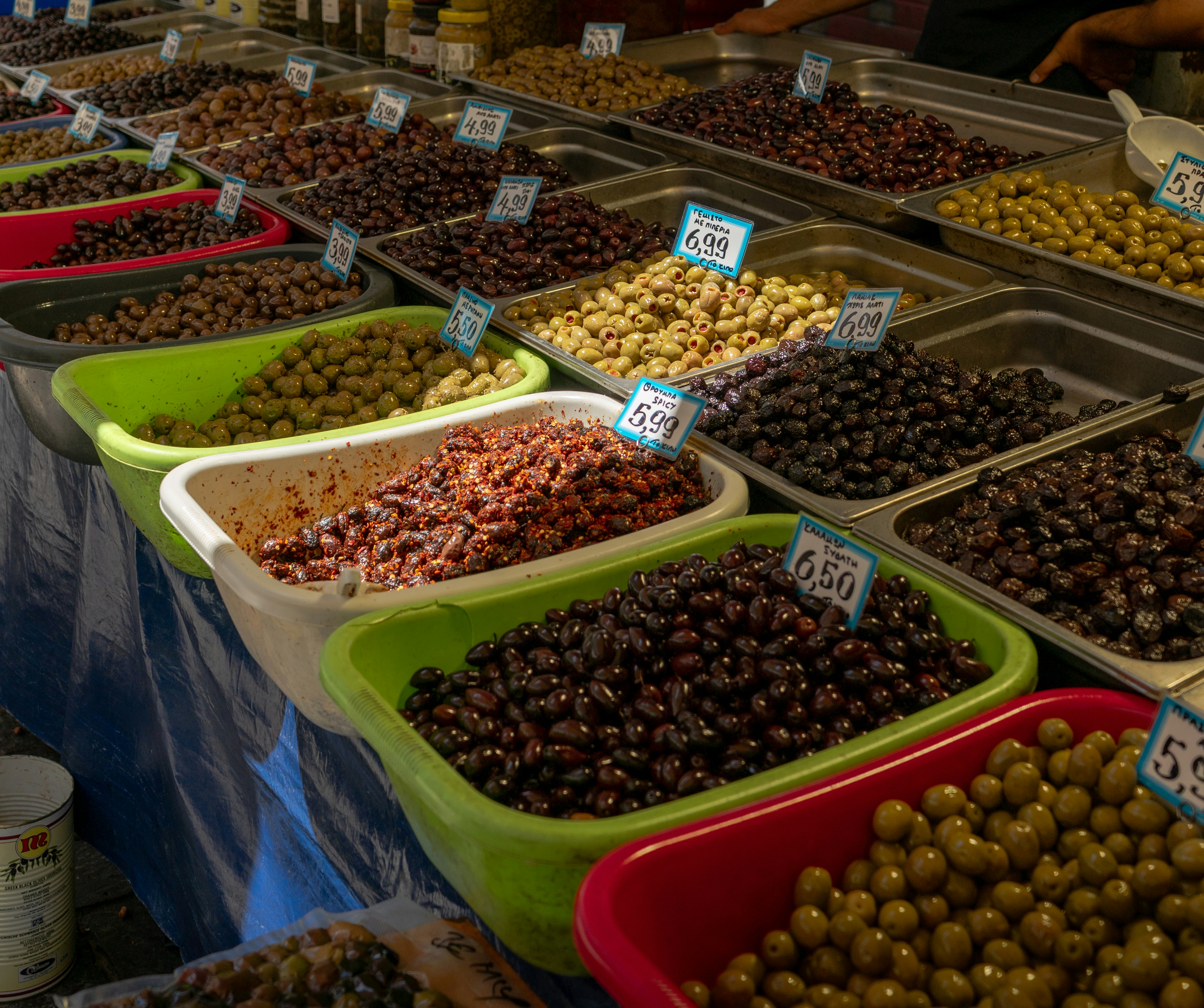 Various types of olives are on display.