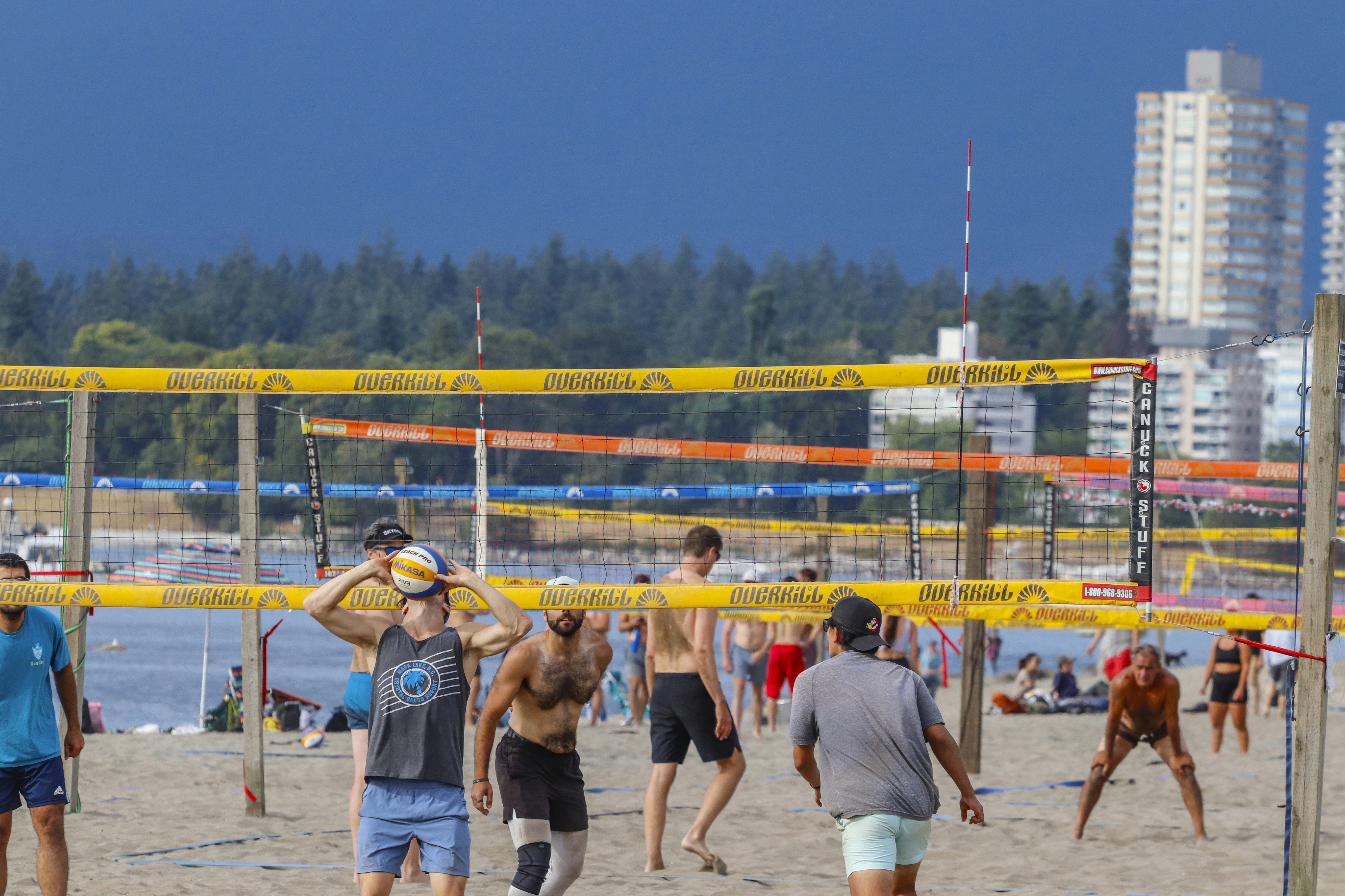 Beachside Volleyball Showdown Under Ominous Skies