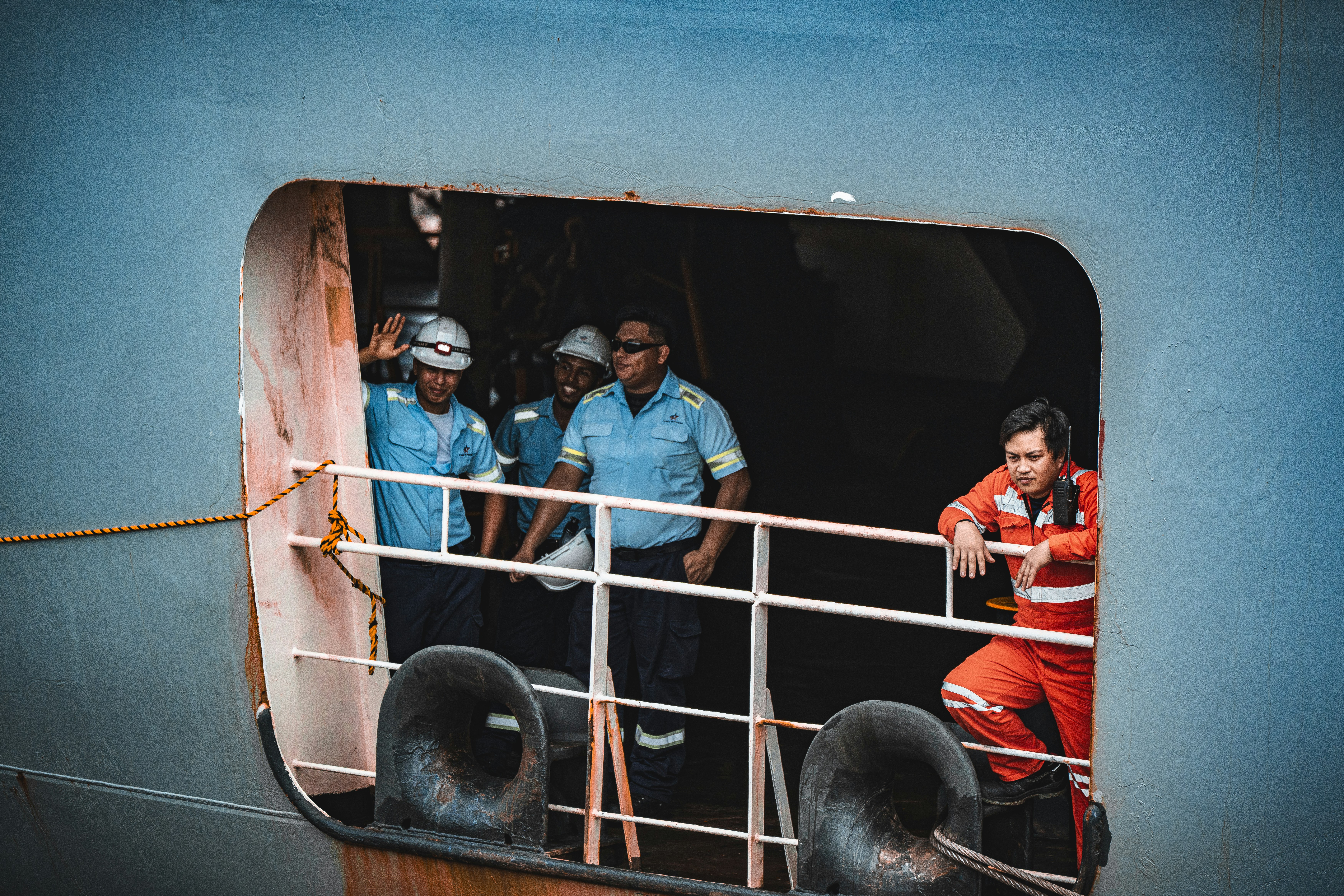 Crew members are onboard a ship.