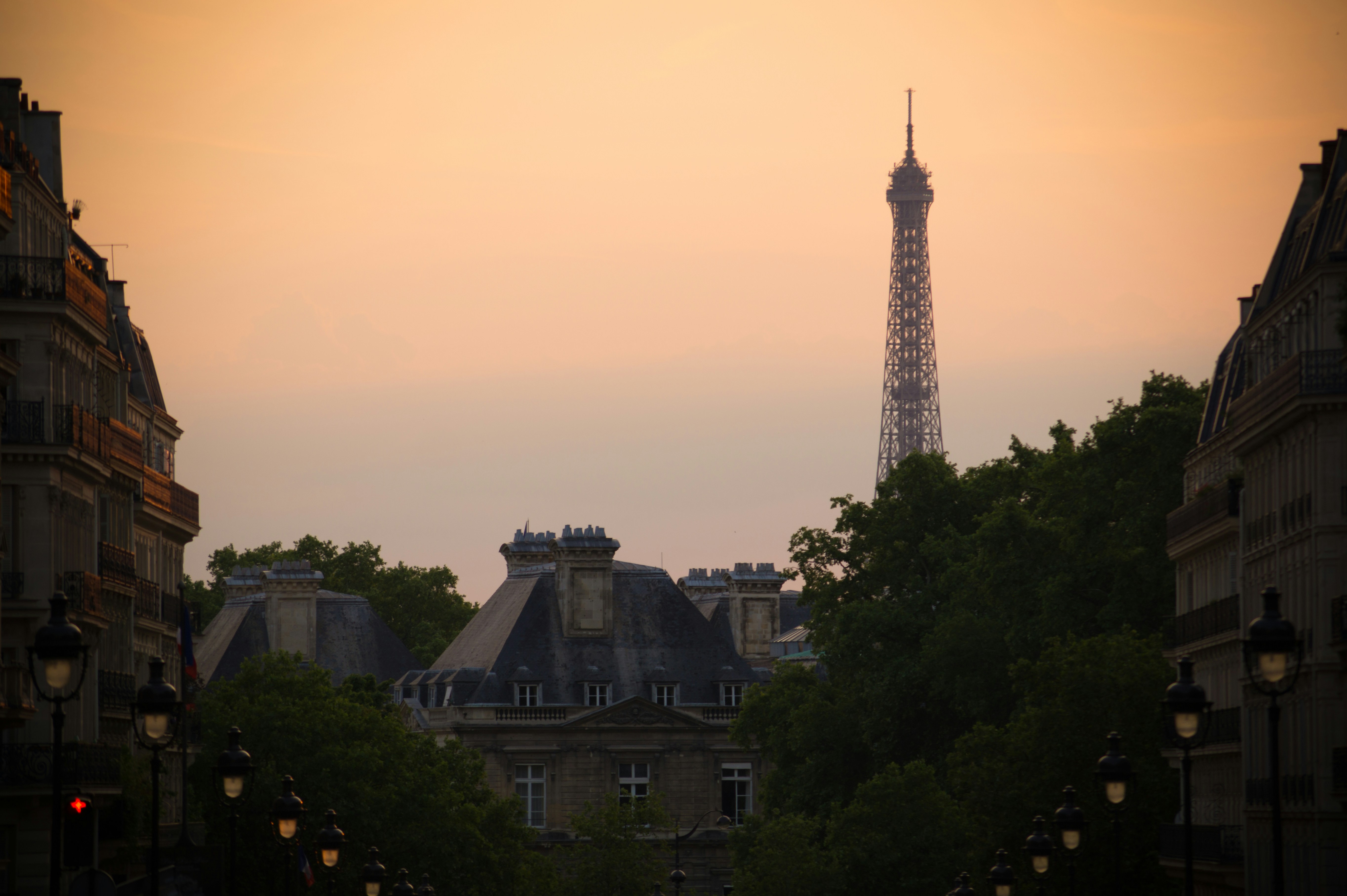 Eiffel Tower, Paris, France on a hot summers day | Eiffel tower stands tall at sunset.