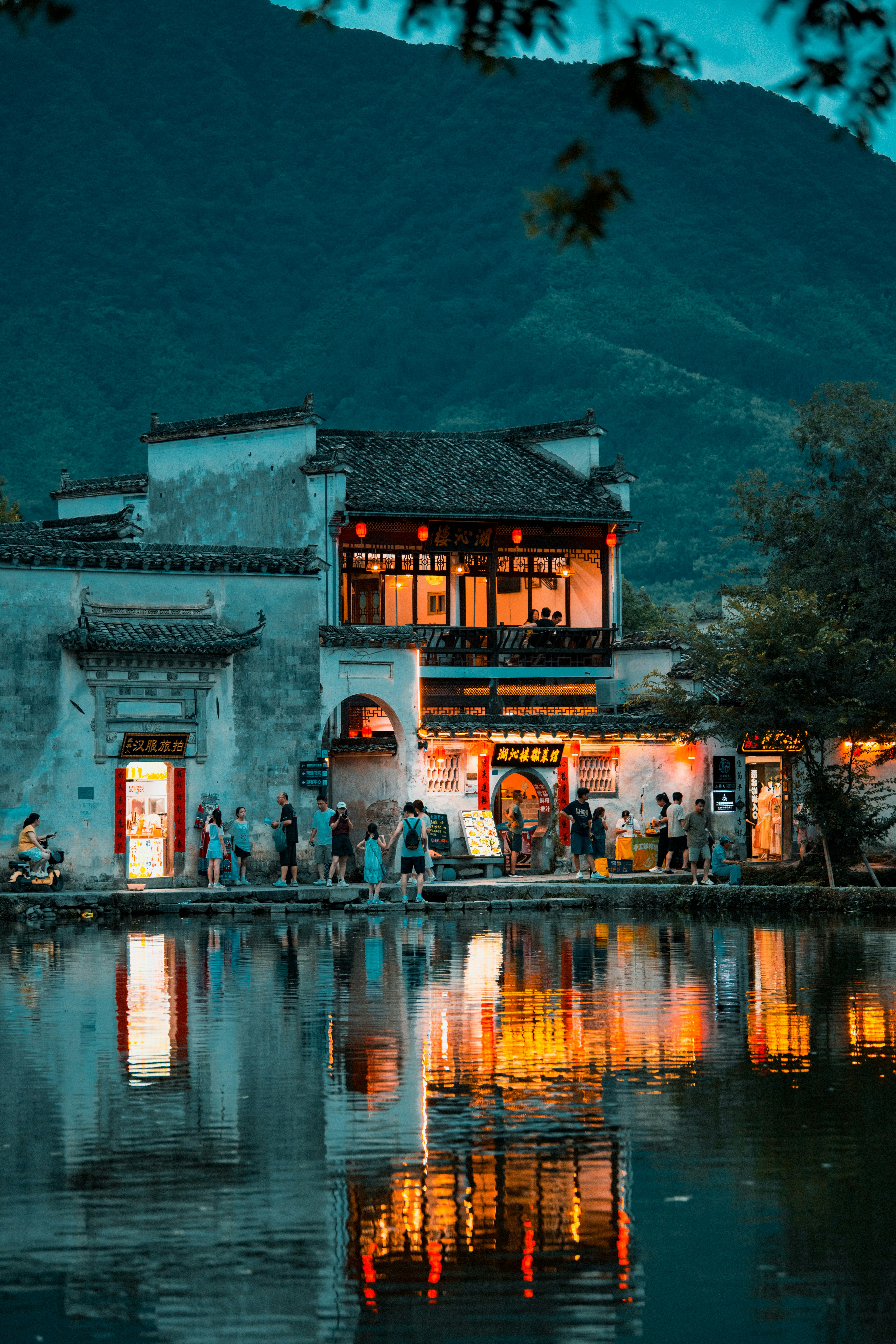 Lantern-lit Riverside Inn: Reflections Beneath a Mountain Twilight