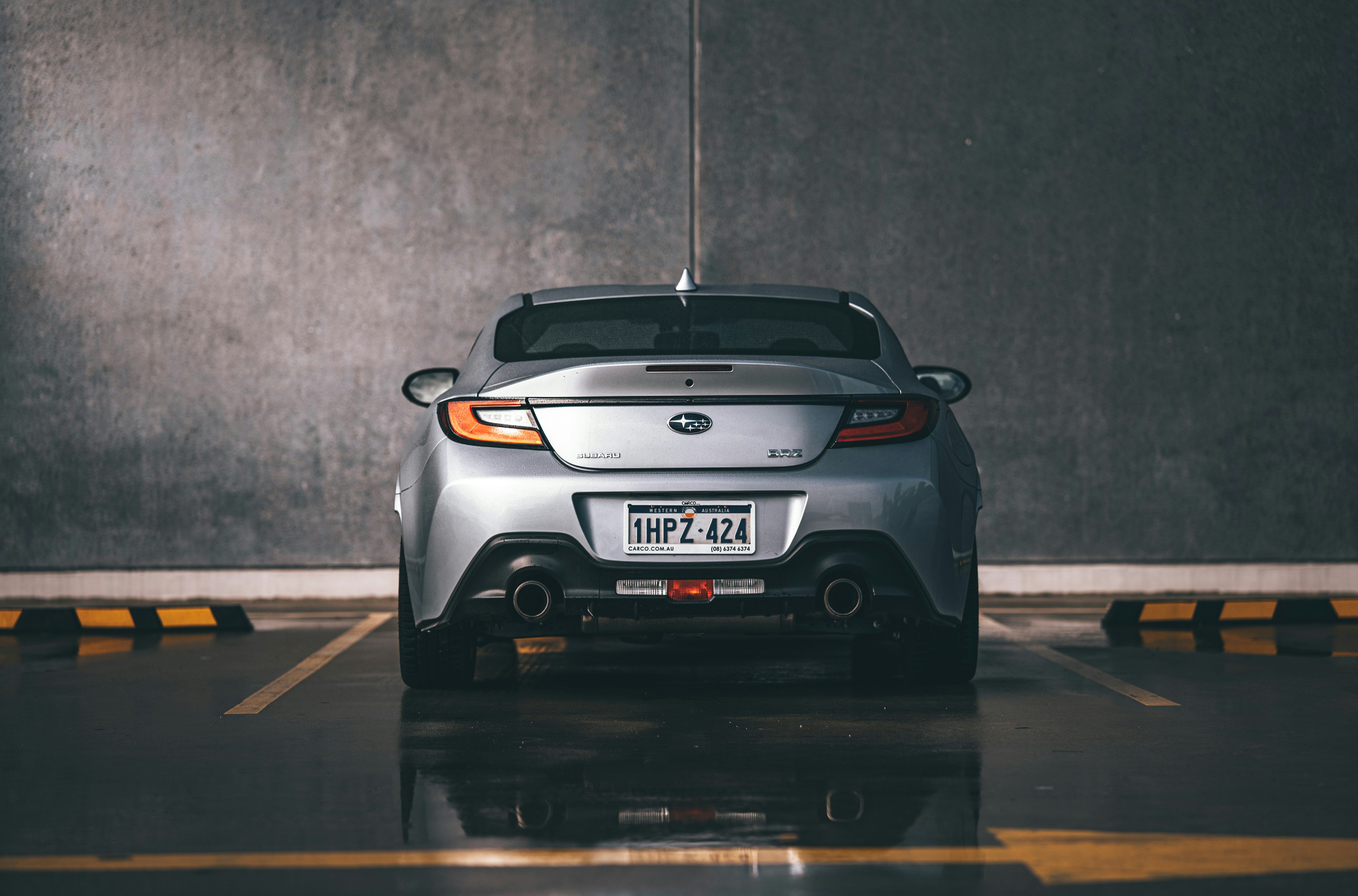 Urban Elegance: A Silver Sports Car in the Shadows
