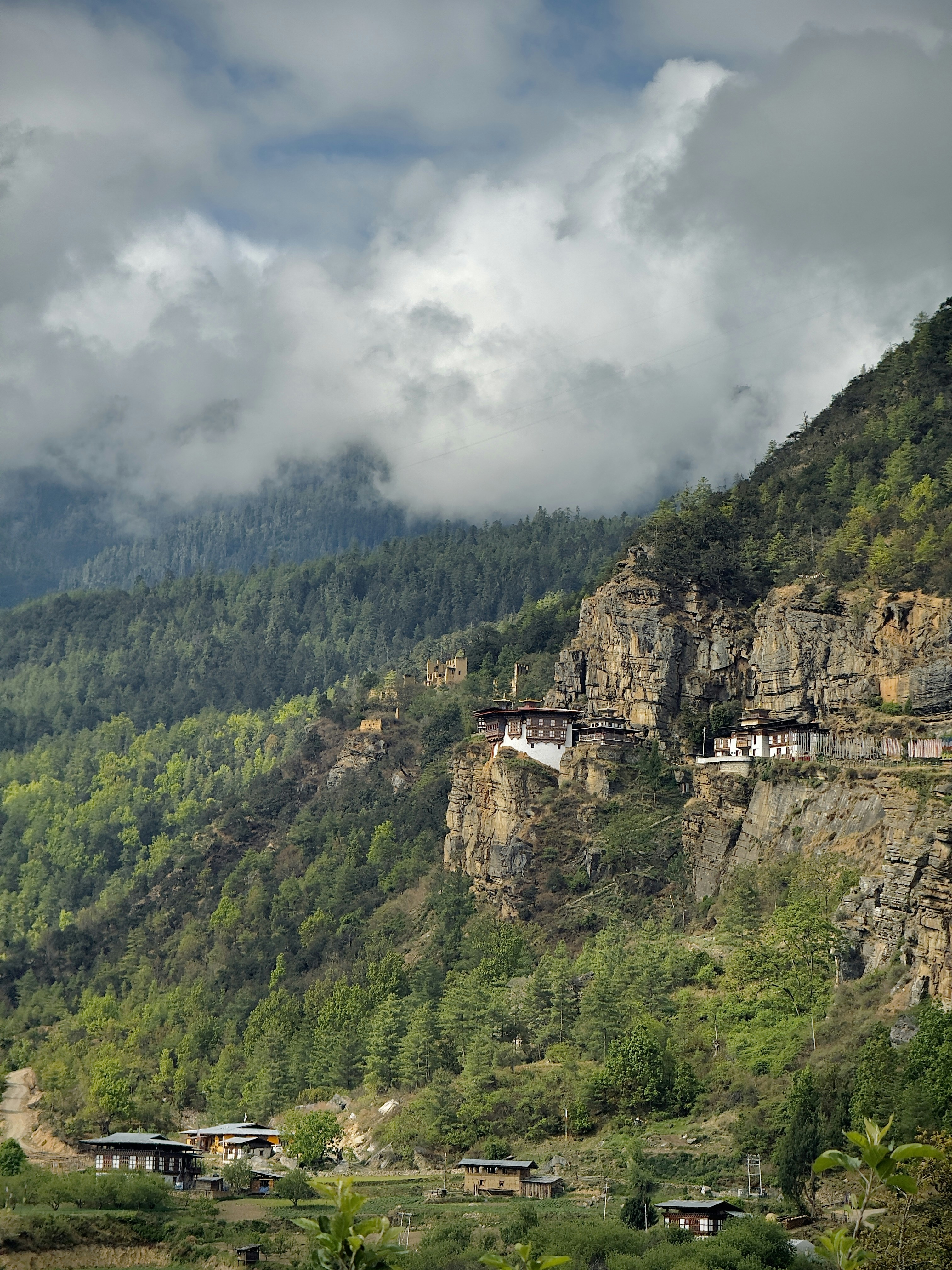 Mountain monastery built into a steep cliff face.