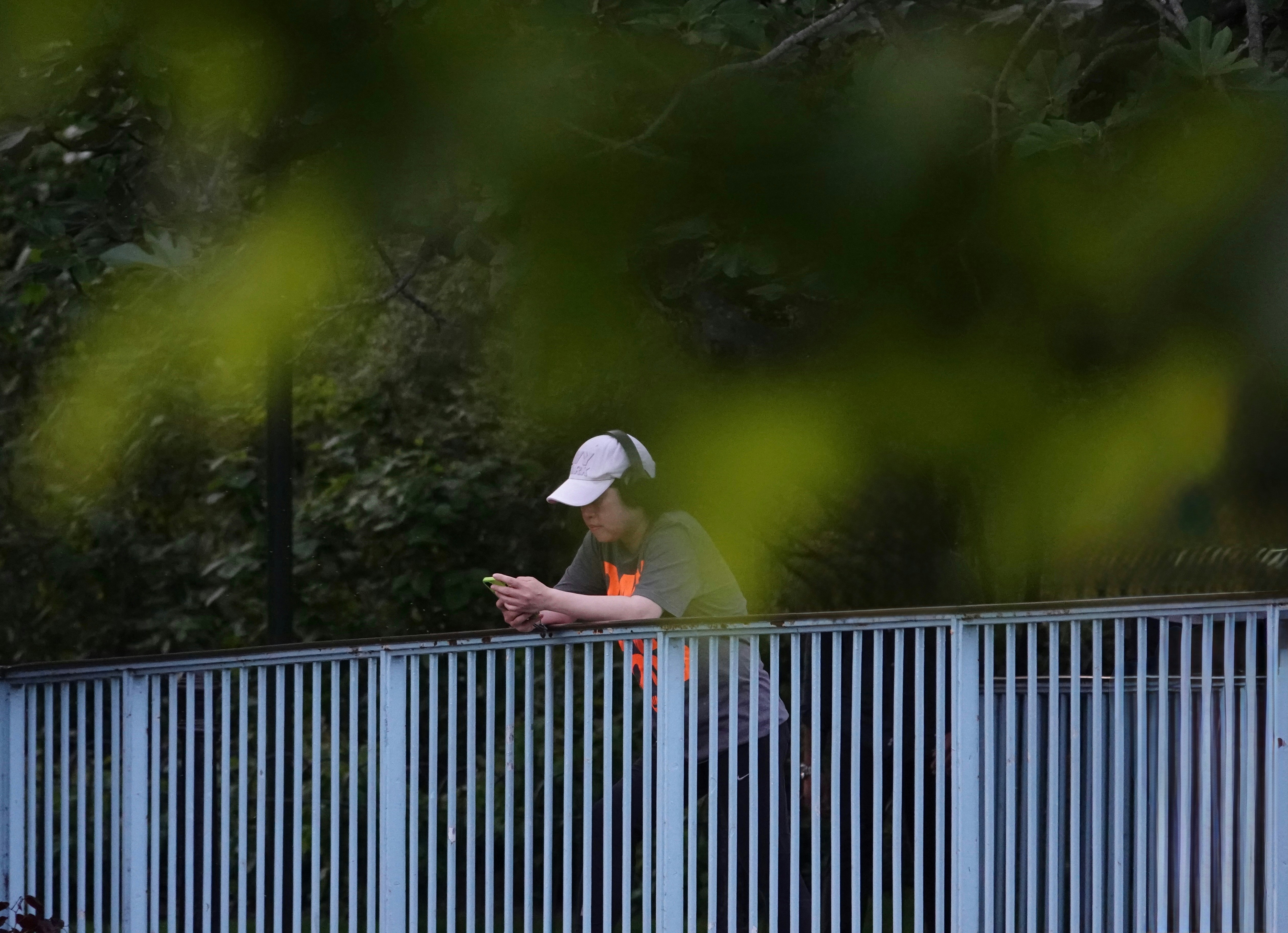 Urban jogger on a railing: a moment paused in motion