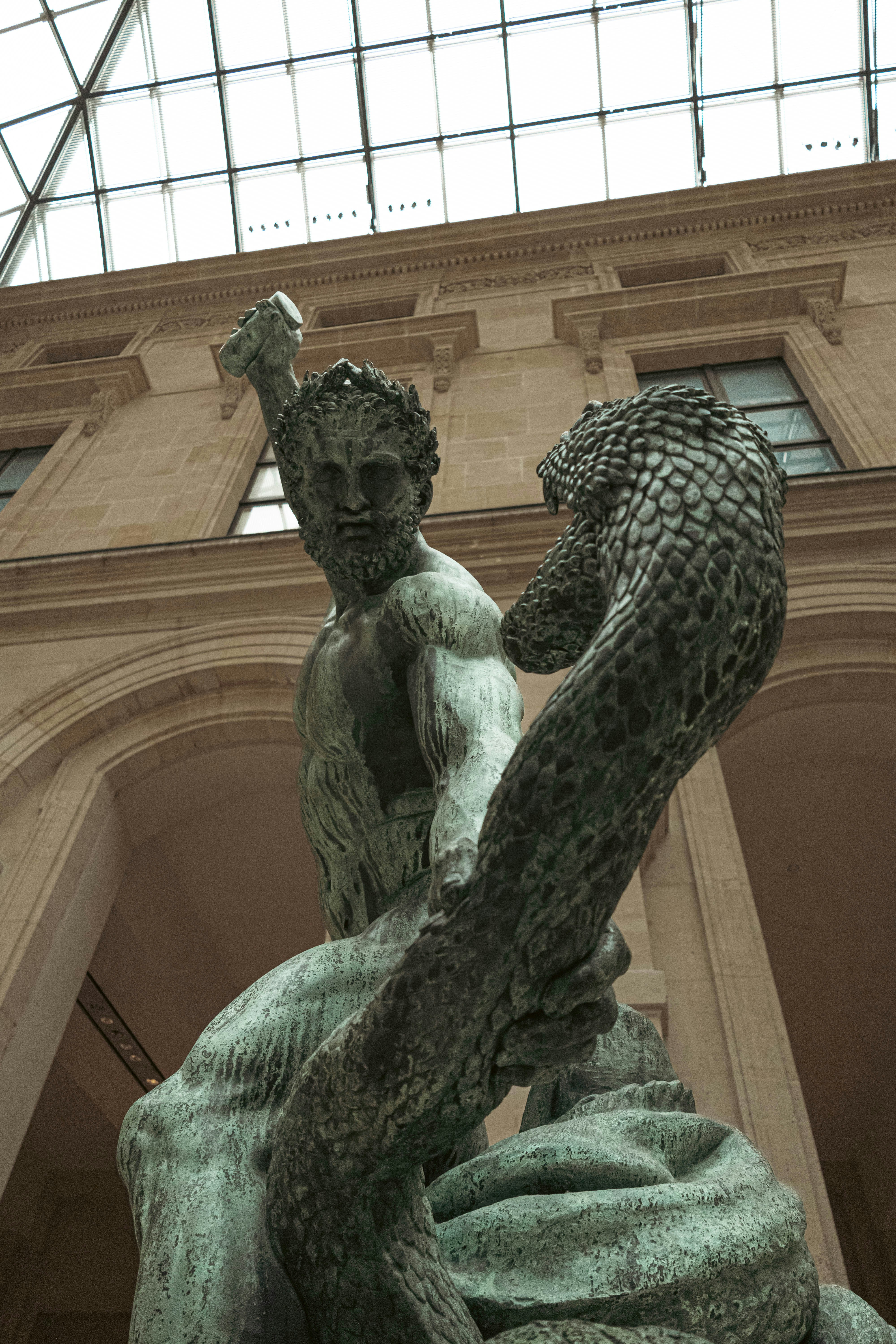 A statue of hercules fighting a snake. photo – Free Art Image on Unsplash