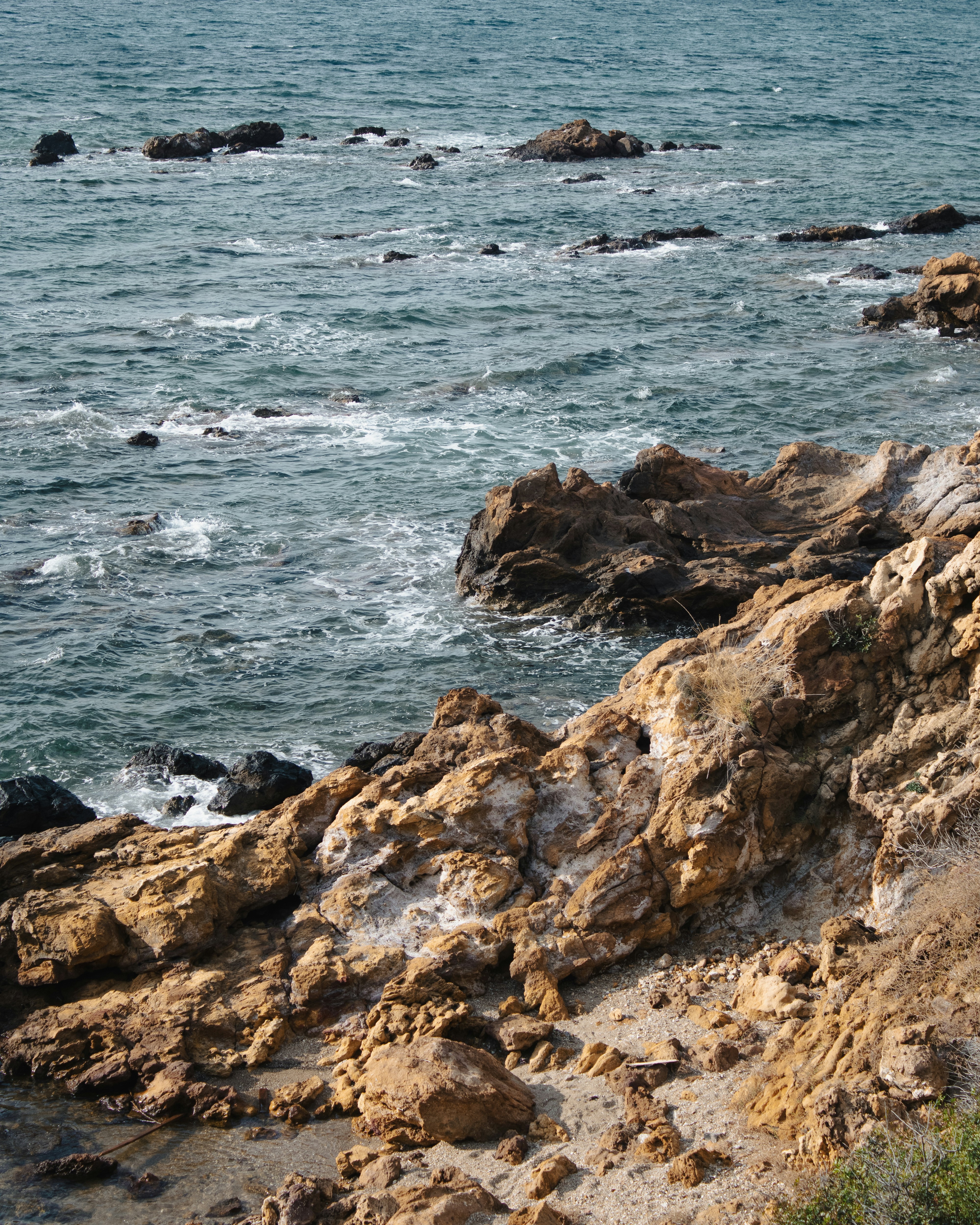 Rocky Seashore in İzmir, Türkiye | Rocky shoreline meets the vast, wavy ocean.