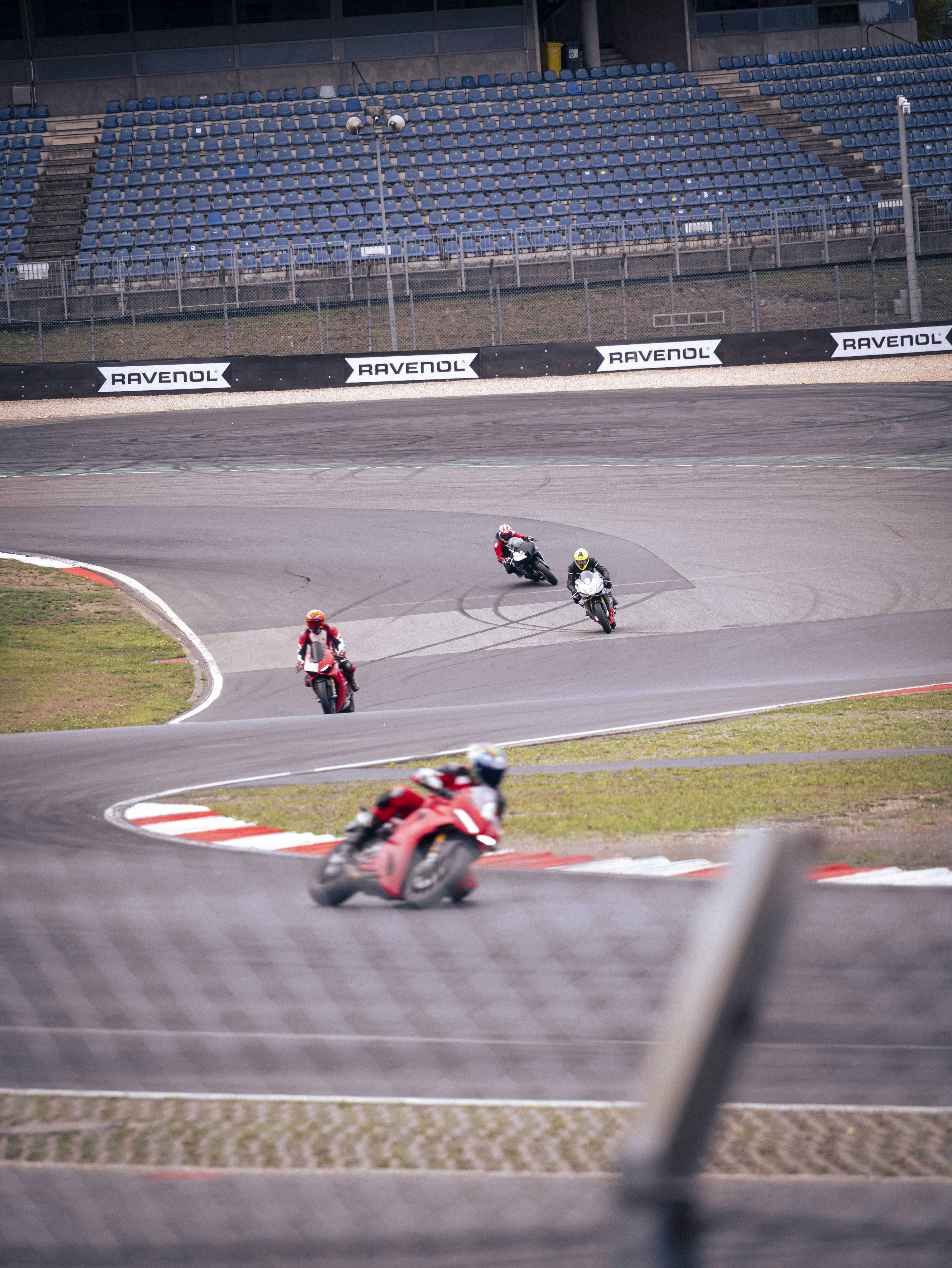 Motorcyclists race around a track.