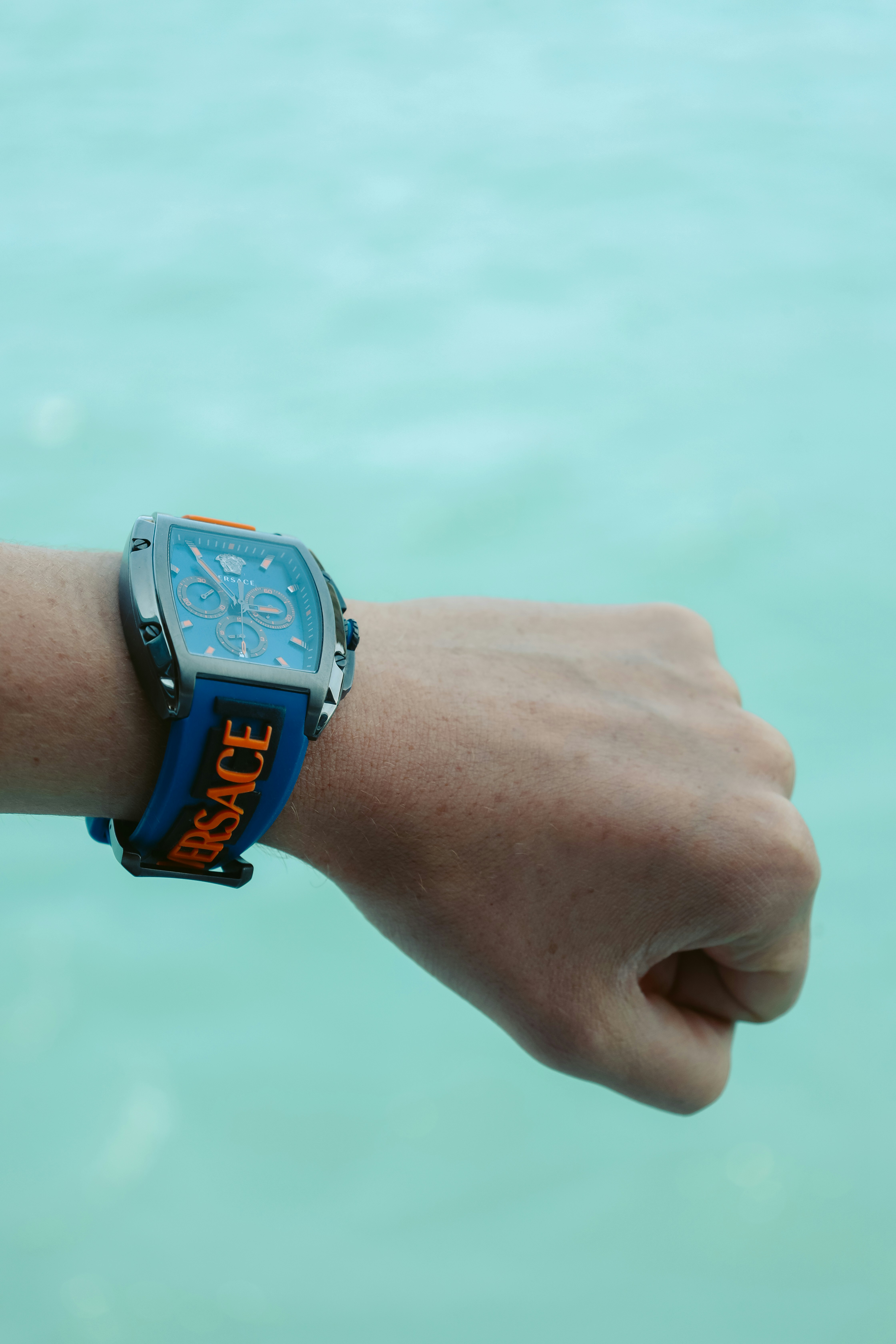 A Splash of Style: Versace Timepiece Against Aquatic Backdrop
