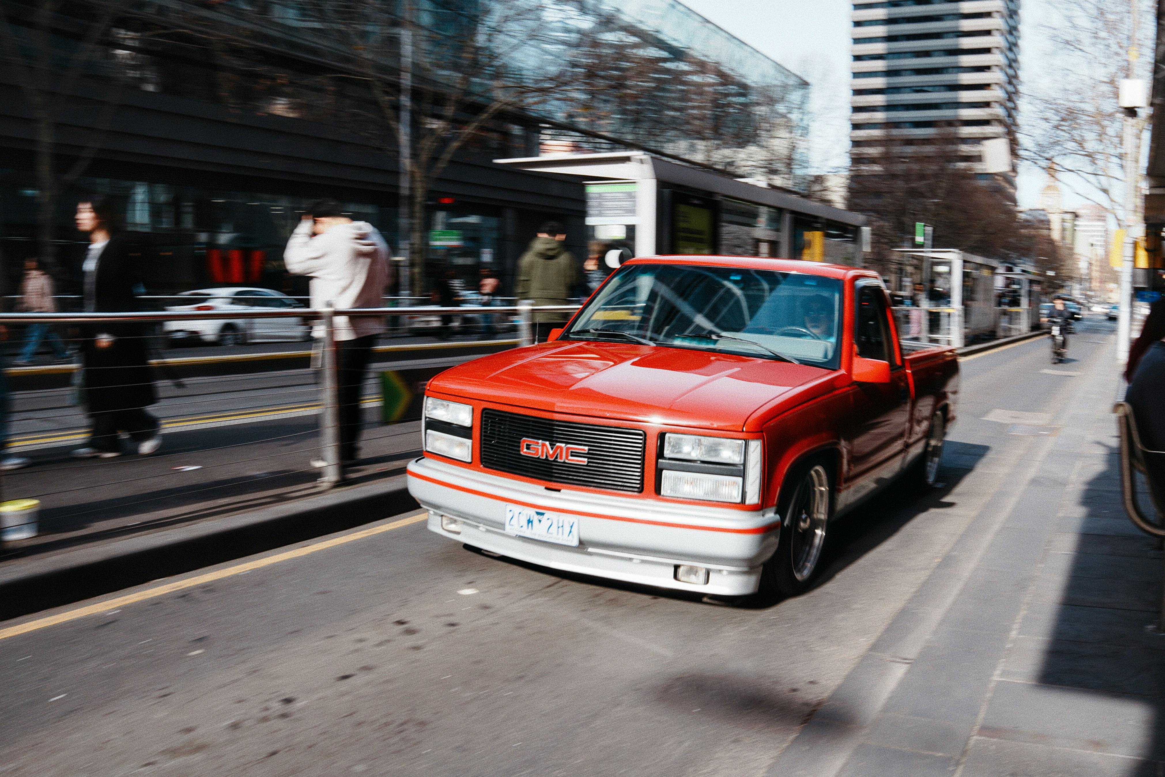 Urban Motion: The Bold Red Pickup