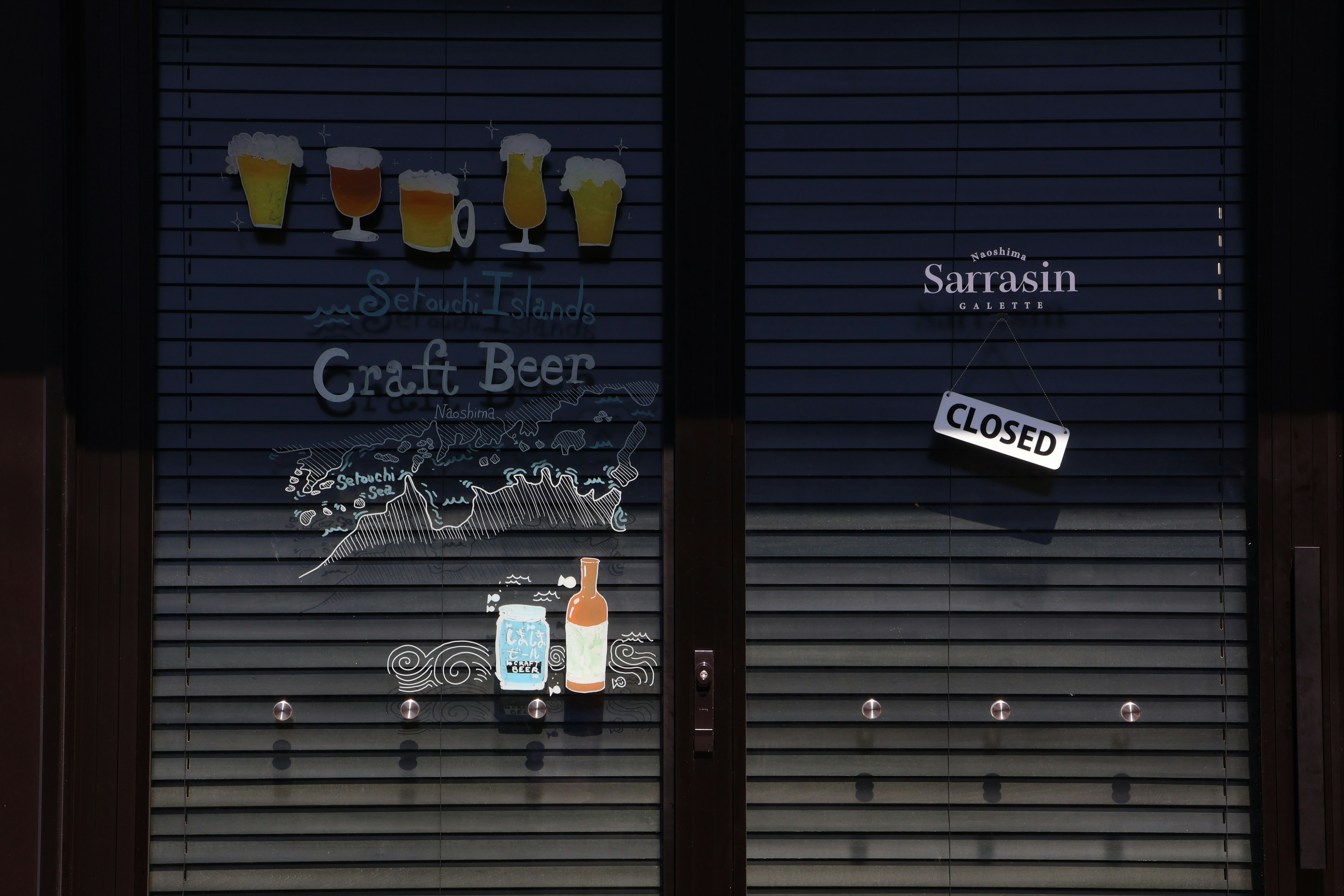A bar is closed, advertising craft beer.