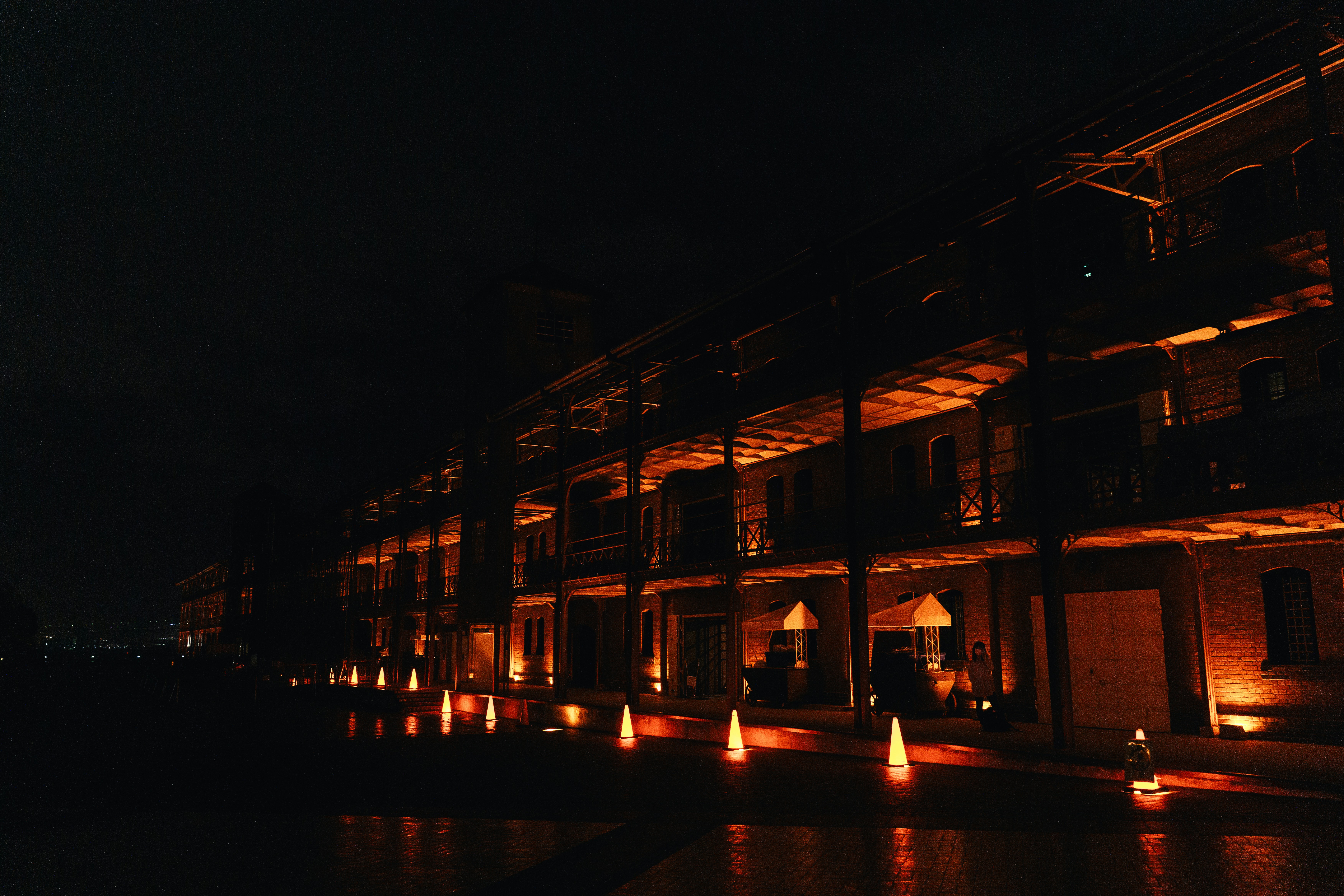 A building is lit up at night.