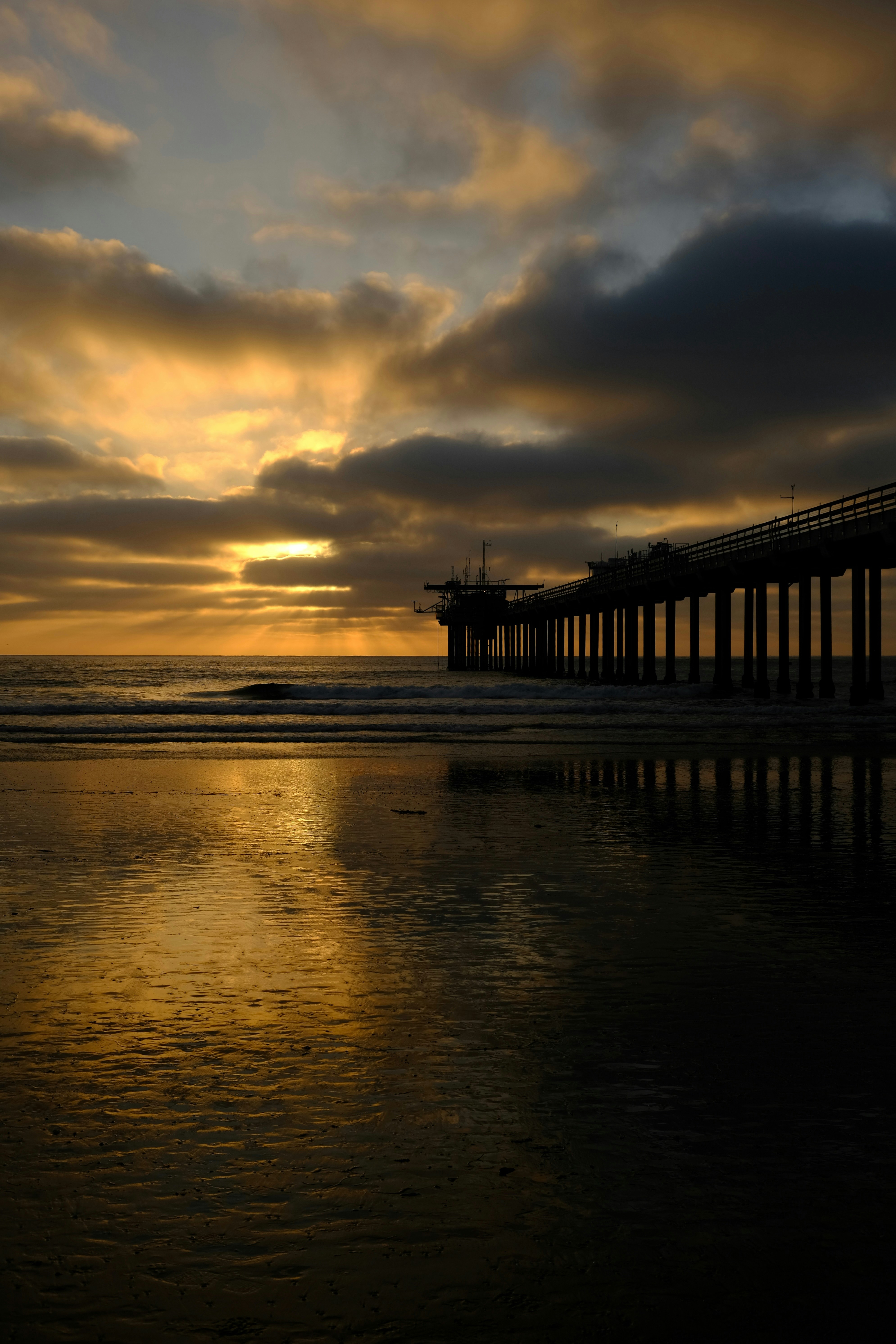 La Jolla, California | Sunset casts a golden glow over the pier.