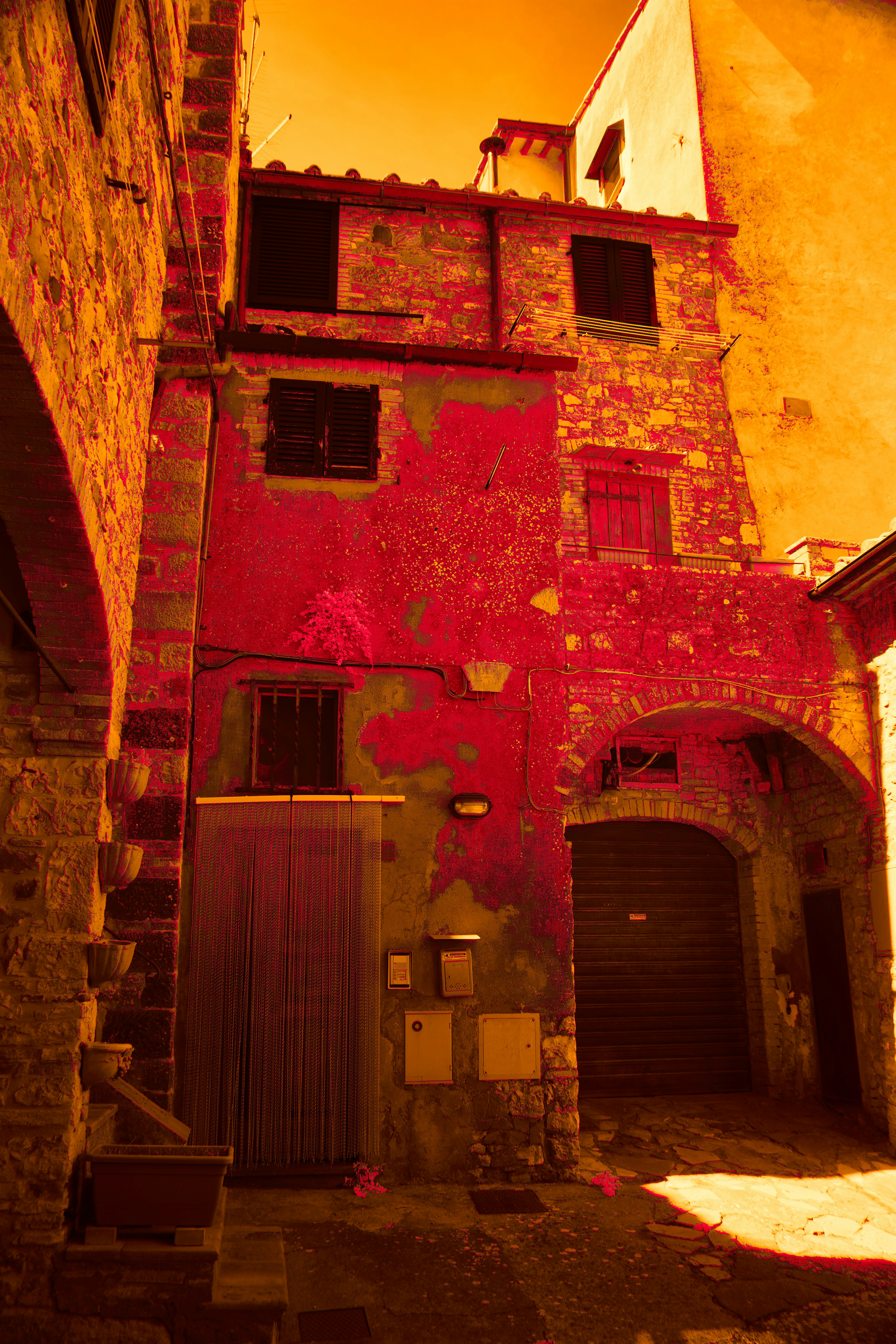 Buildings are bathed in an orange, ethereal glow.