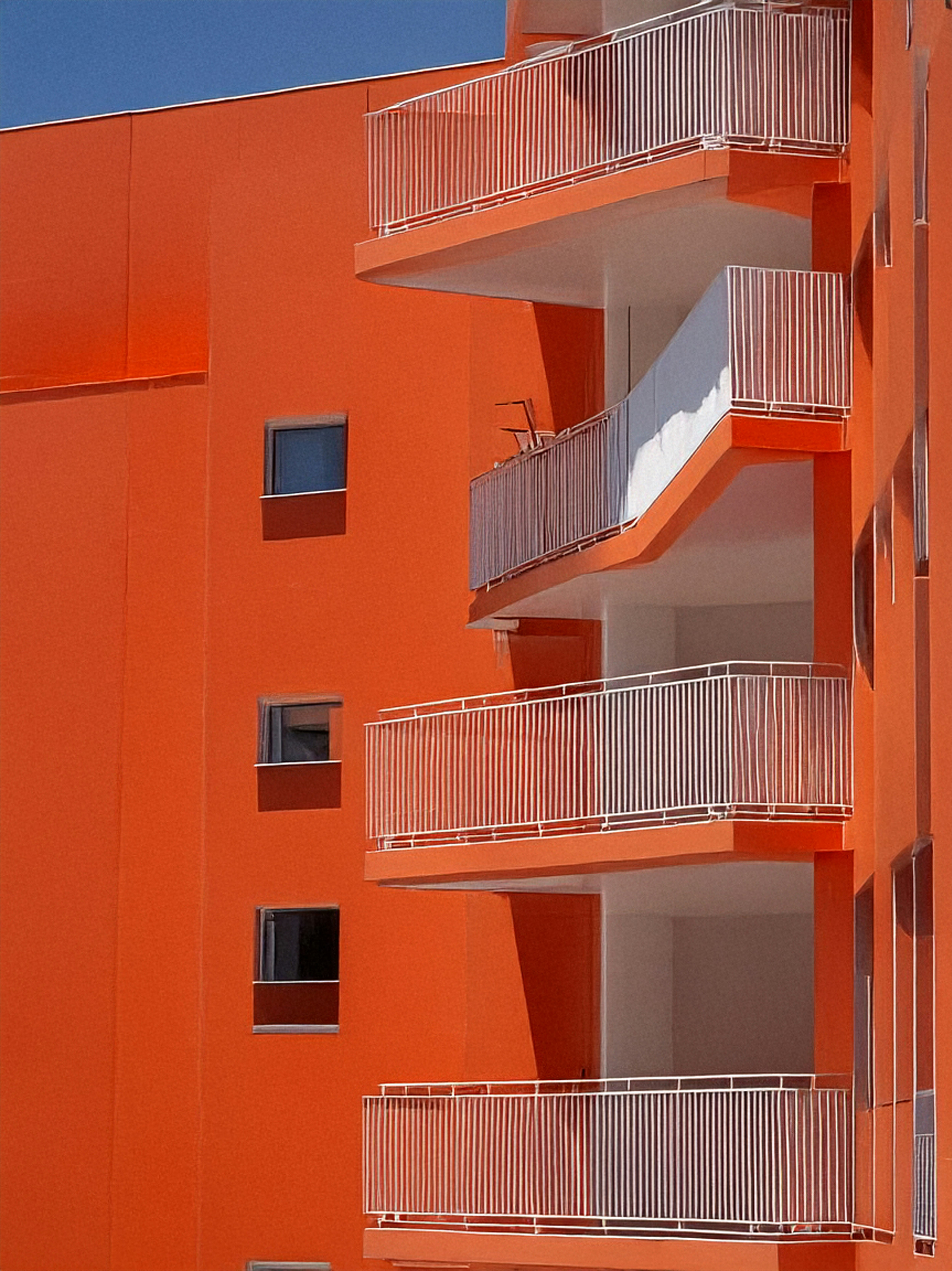 Bright orange building with white balconies. photo – Free Building ...