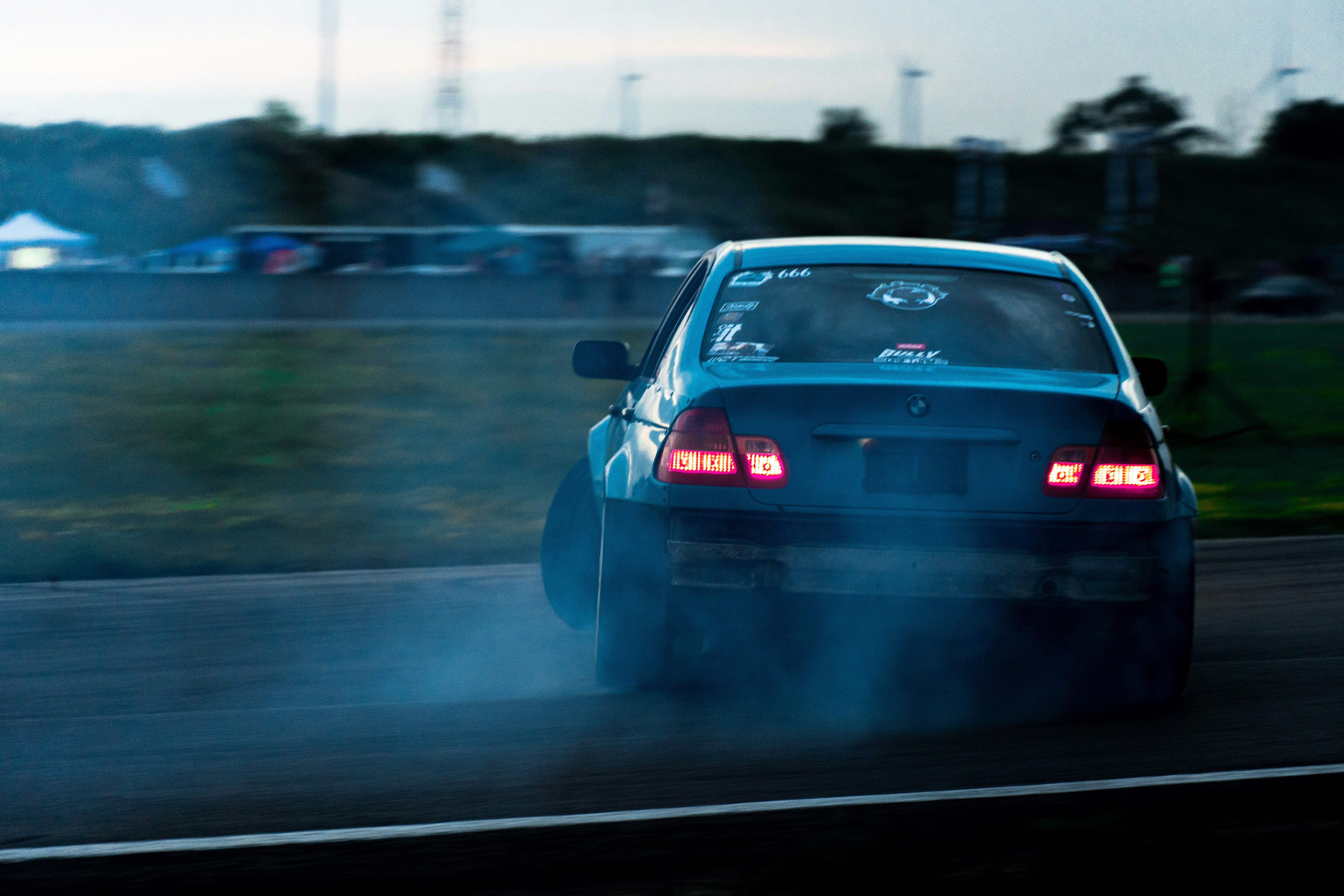 Car drifting on a racetrack, creating smoke. photo – Free Bmw Image on ...
