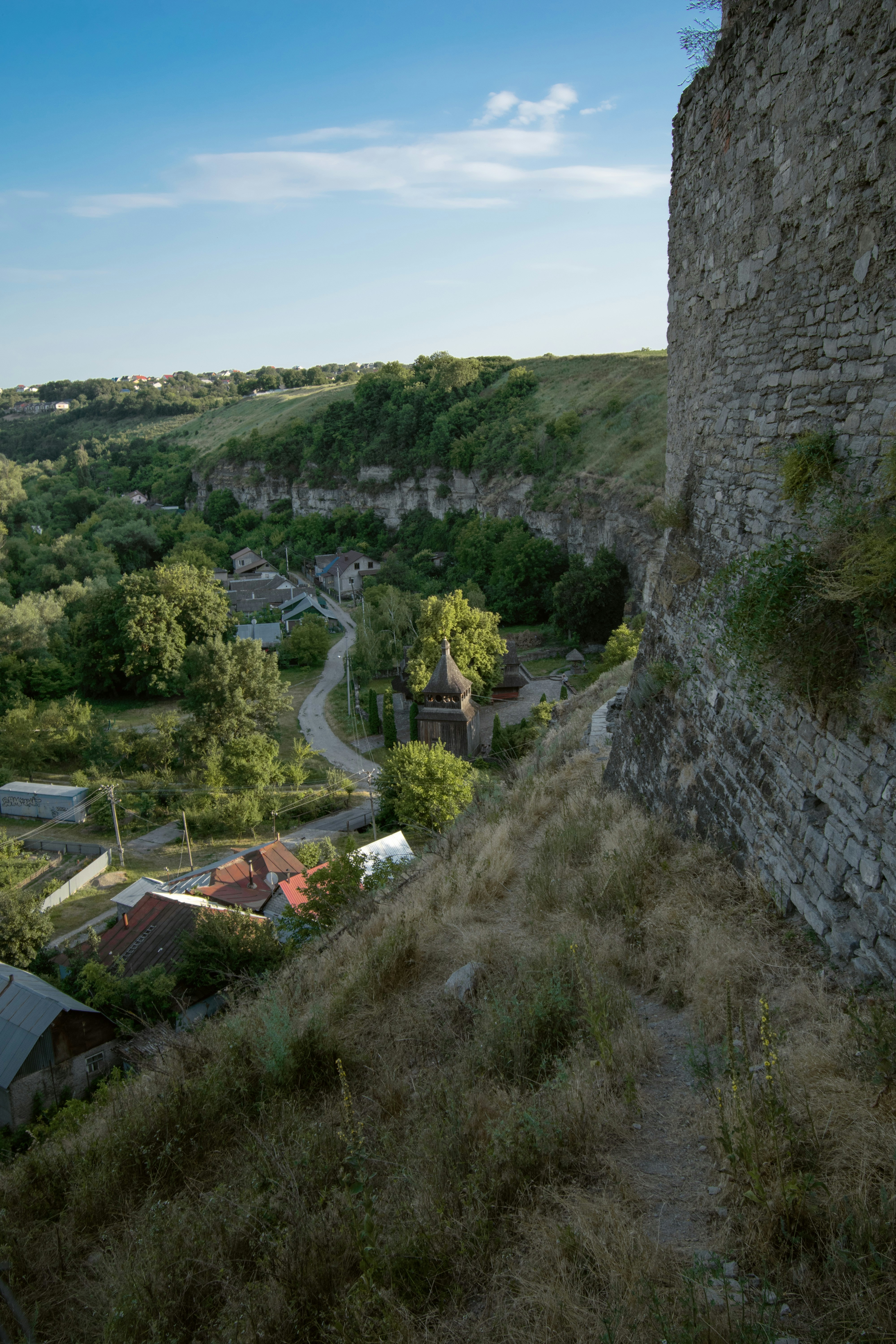 Whispers of Time: A Ruined Fortress Overlooking a Verdant Valley