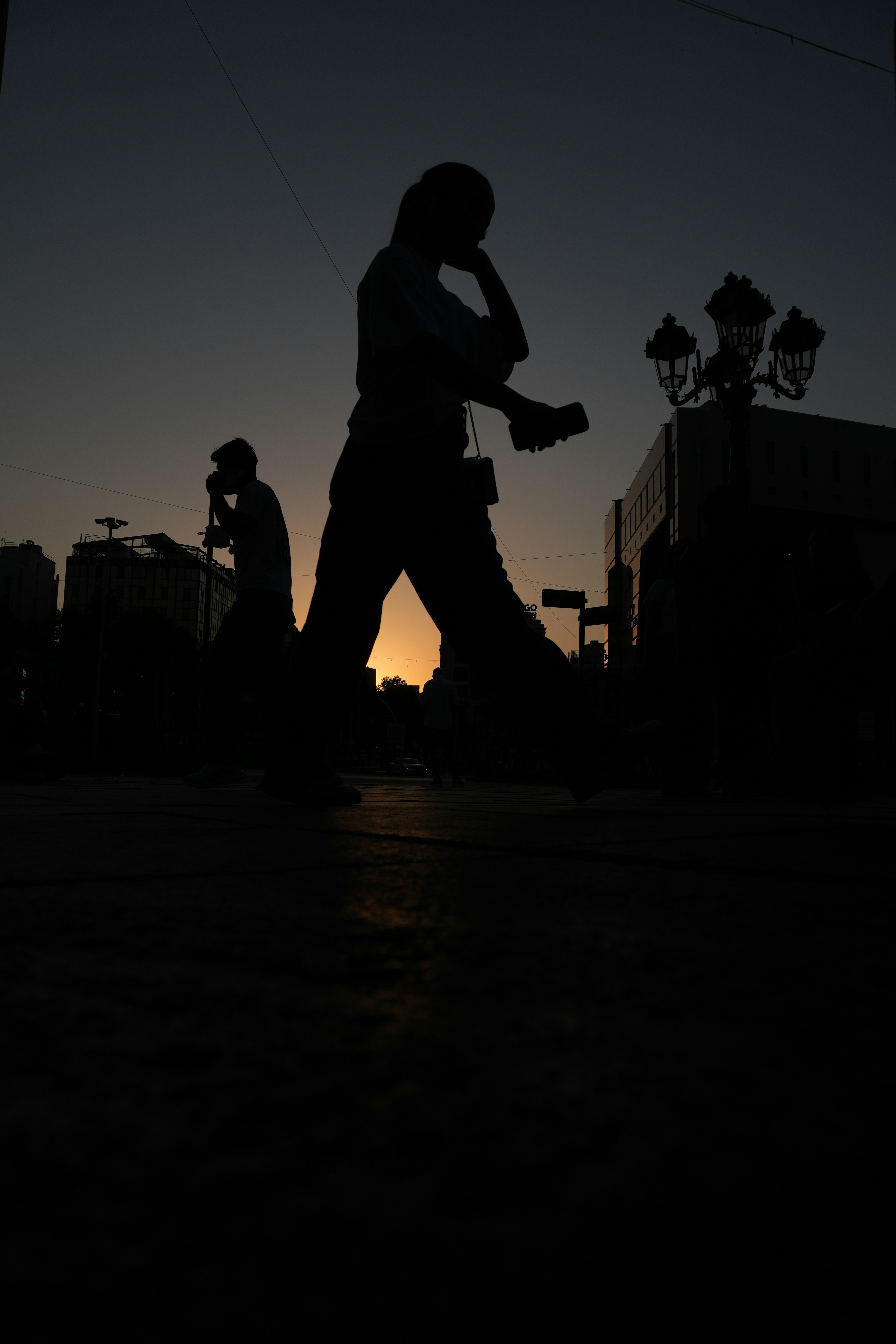 Silhouettes at Dusk: A City in Motion
