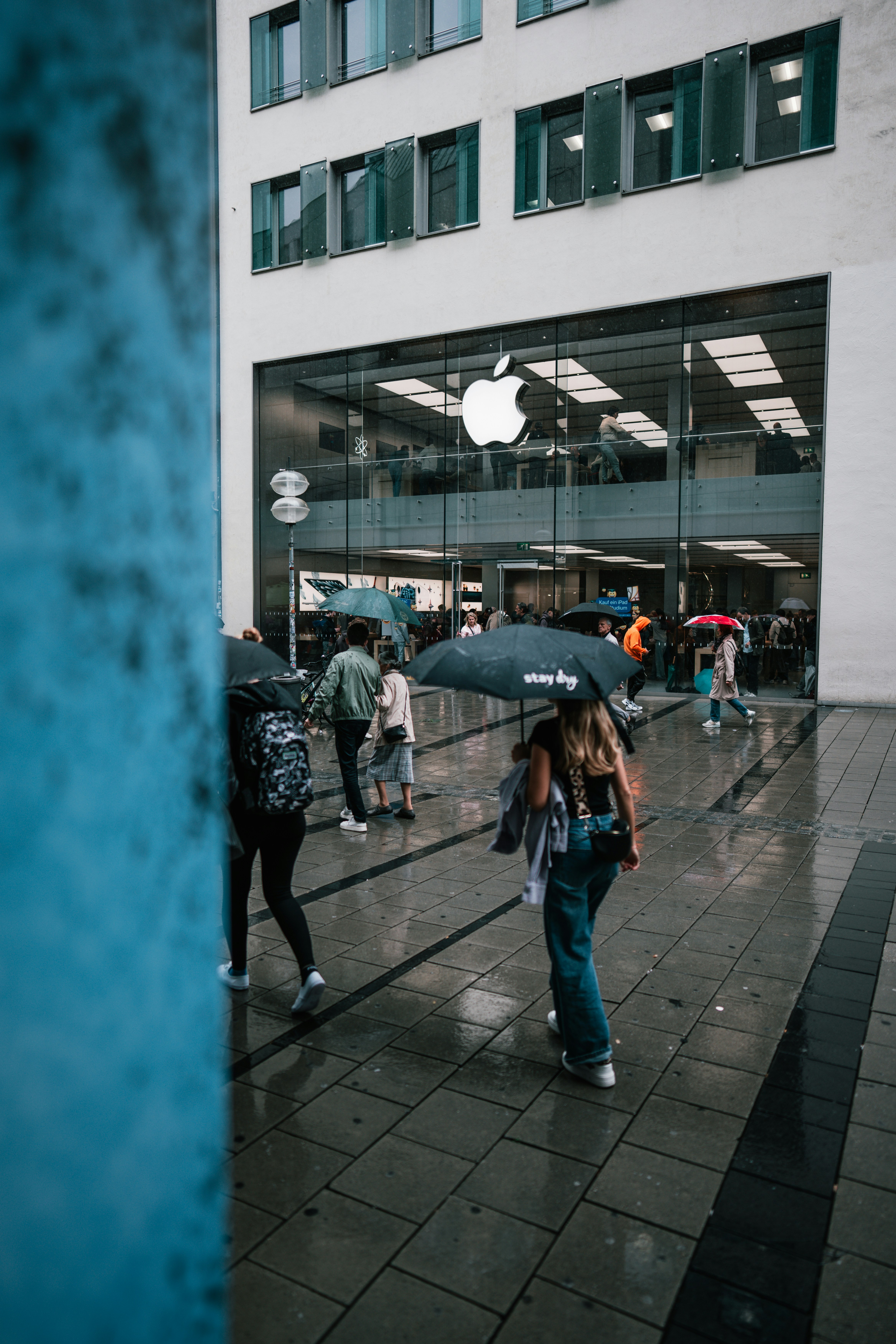 Urban Reflections: A Rainy Day at the Apple Store
