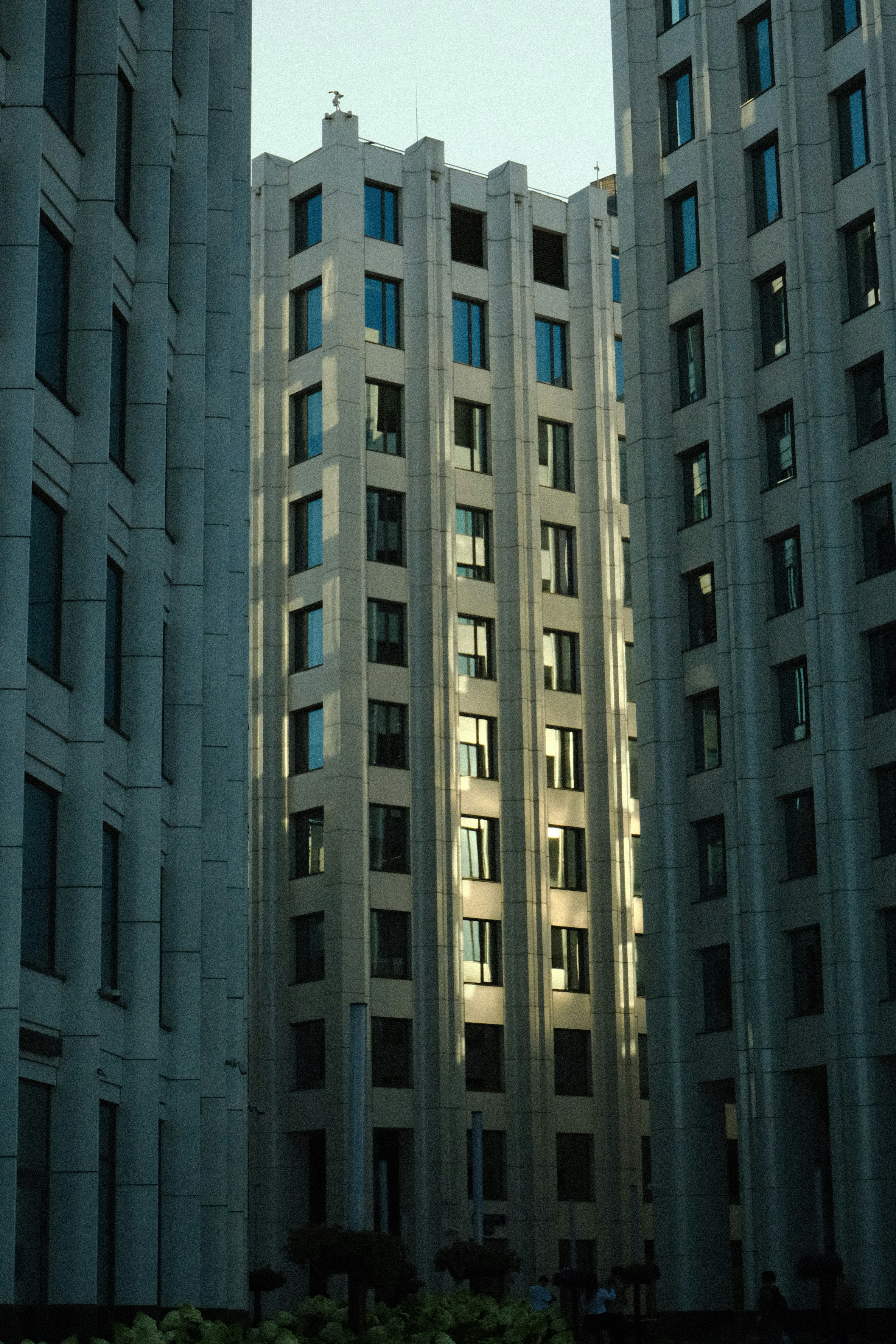 Skyscrapers stand tall against a sunny sky.