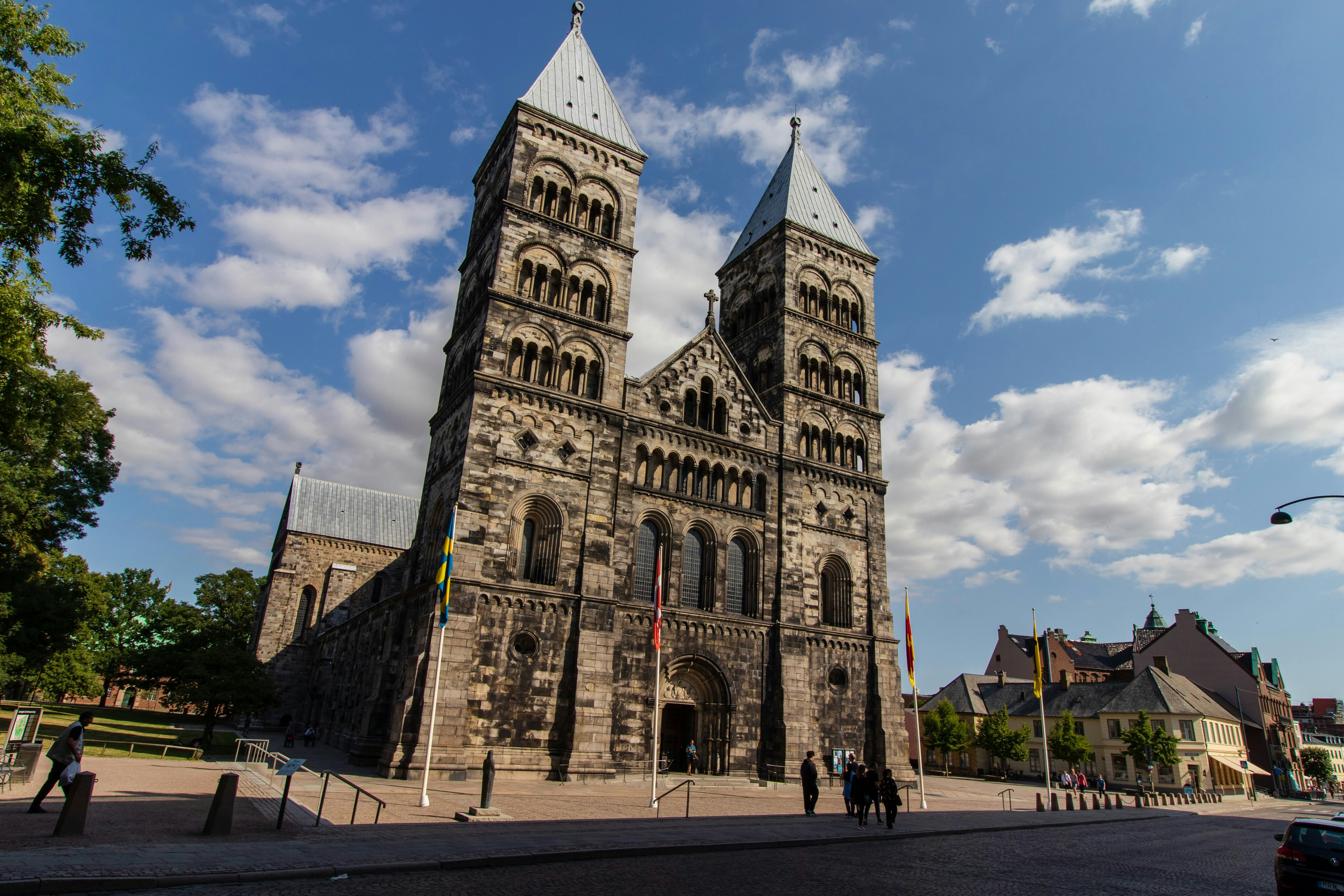 Lund Cathedral | A tall church stands prominently under a sunny sky.