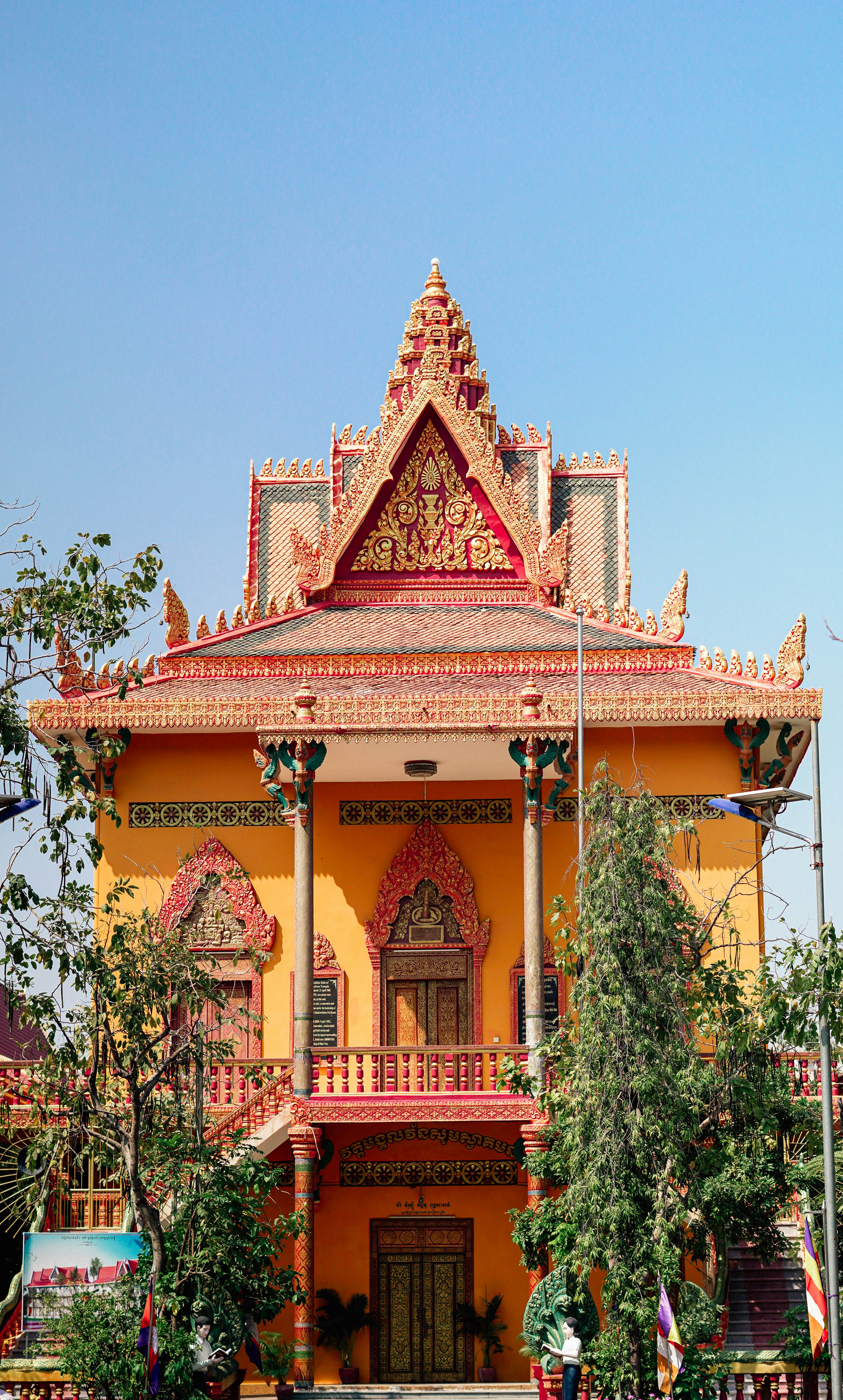 Pagoda | An ornate, golden building under a clear blue sky.