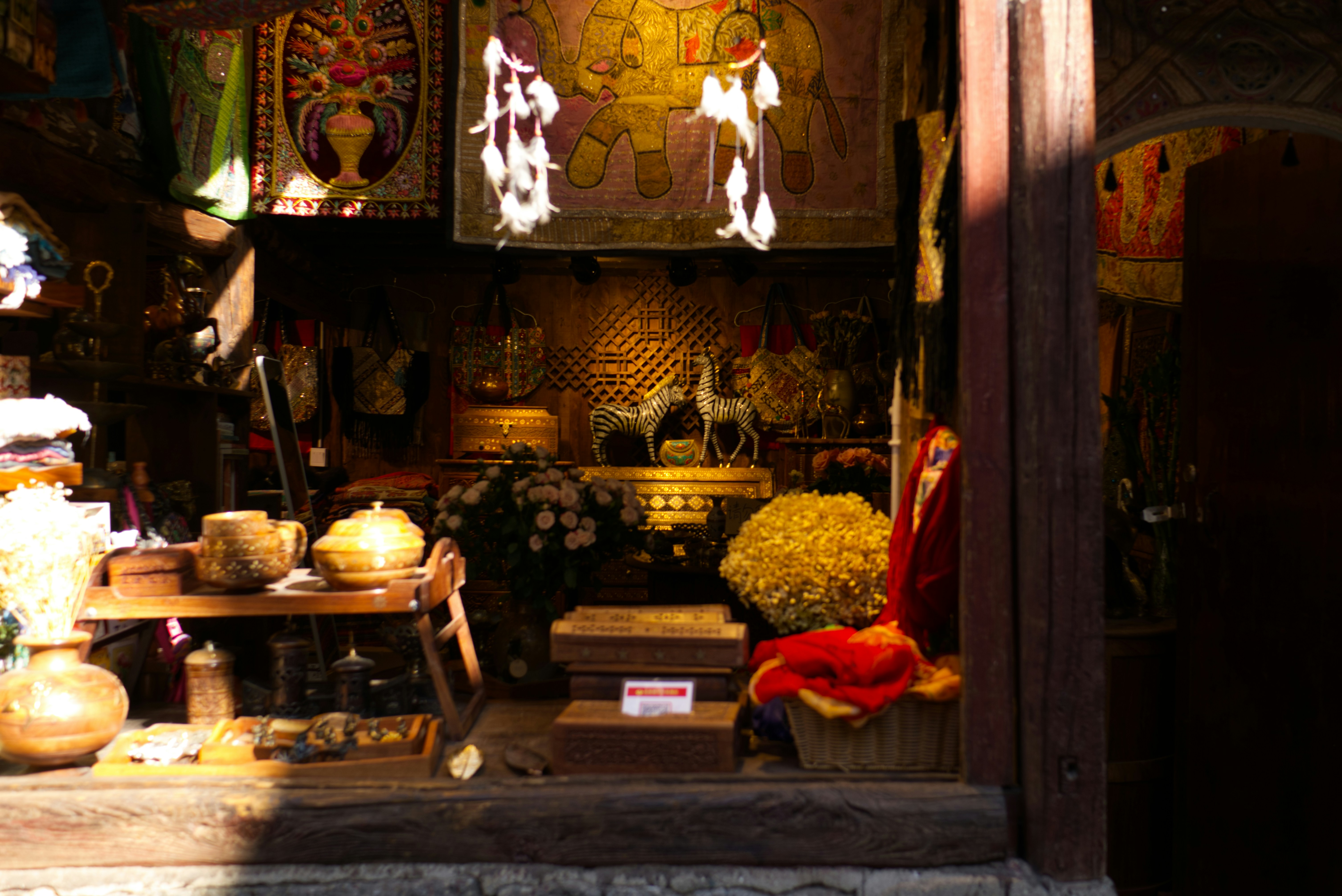 A curiosity Shop | A window displays an eastern shrine.