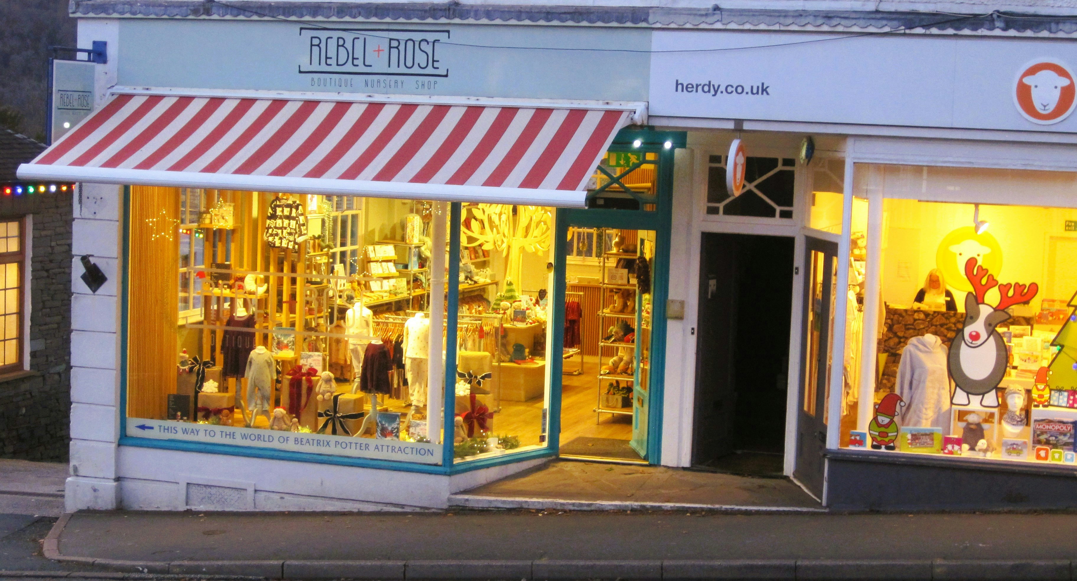 taken november 2023 | A store is open with inviting windows.