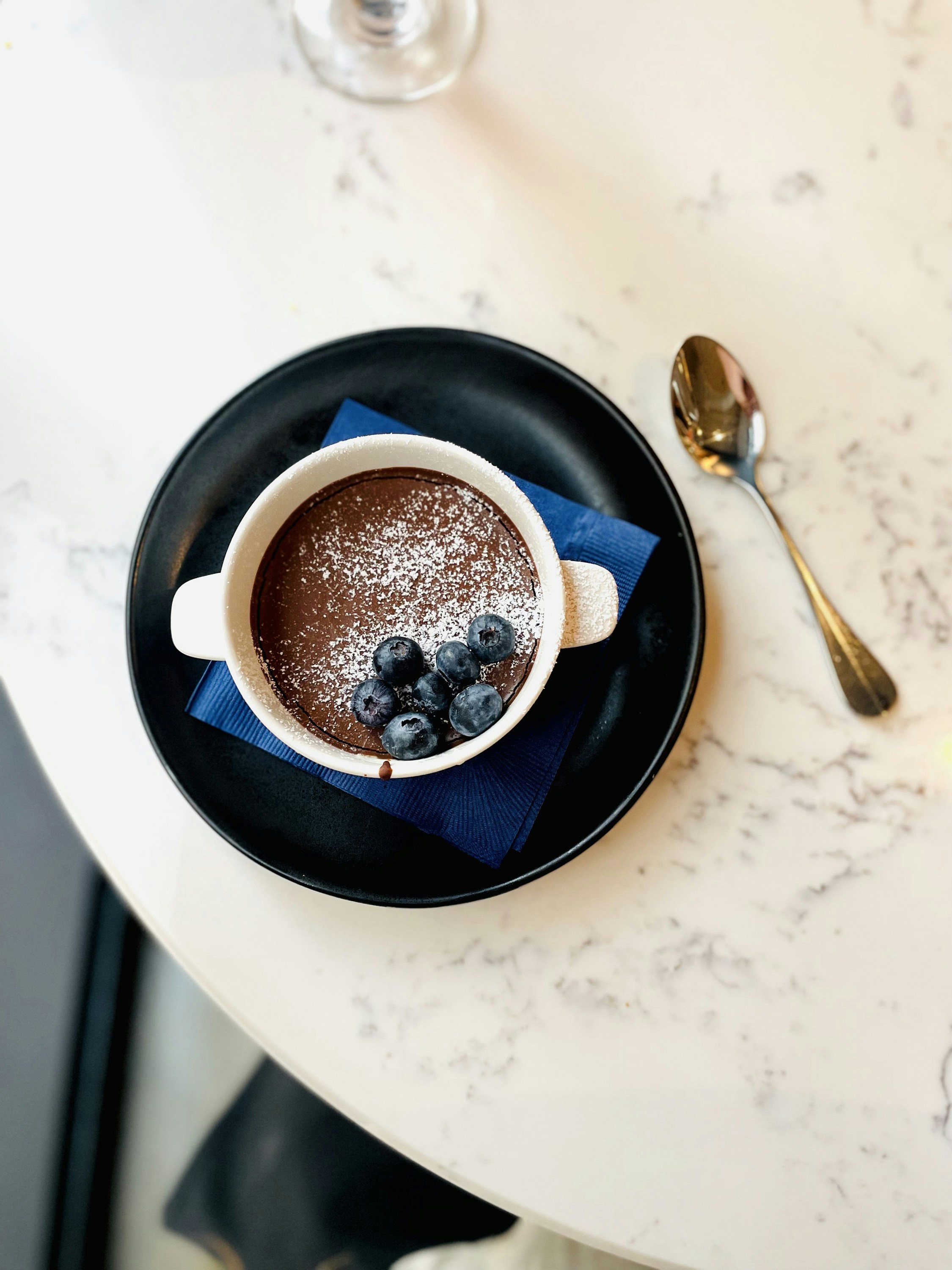 Chocolate dessert with blueberries is ready to eat.