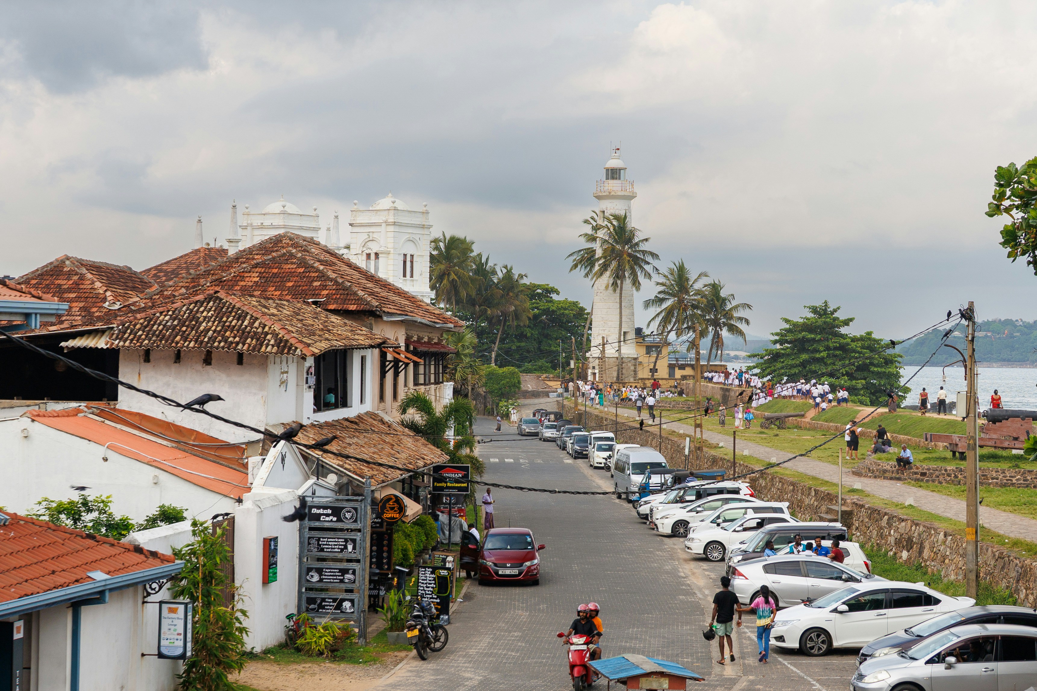 Street scene with a lighthouse in the distance.