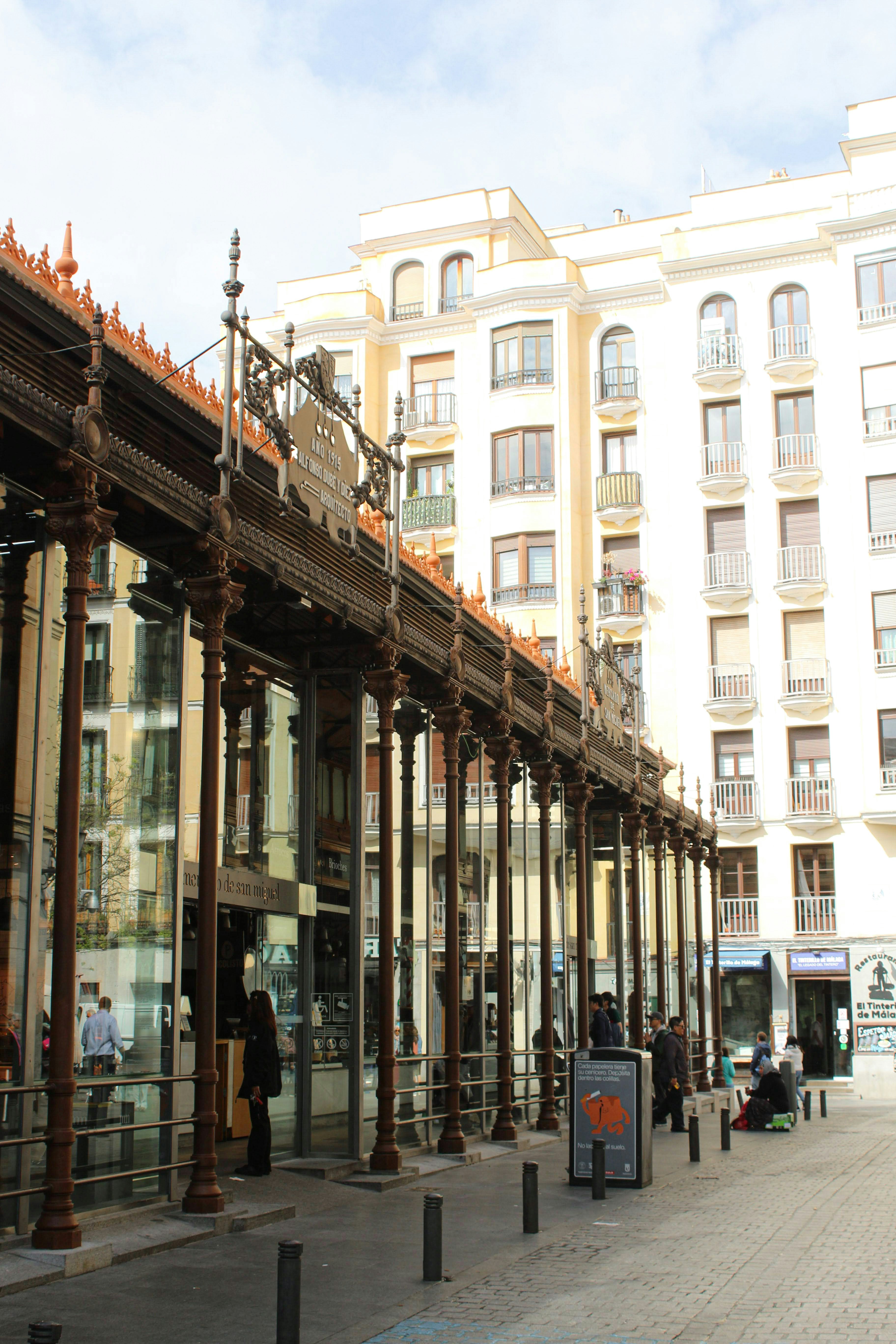 Iron Arches, Sunlit Facades: A Street Carved by Time