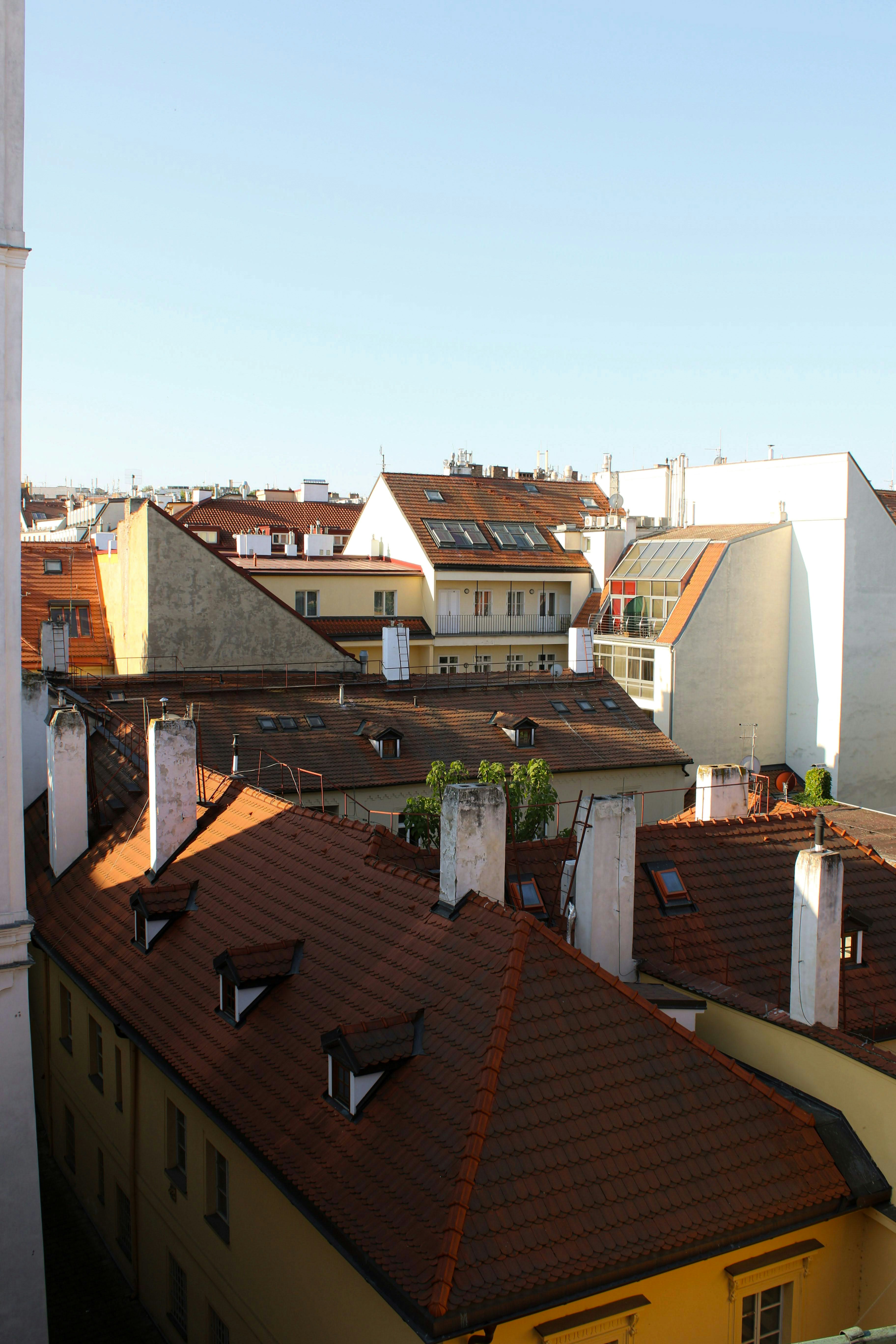 Urban Rooftop Mosaic: A Tapestry of Terracotta and Sky