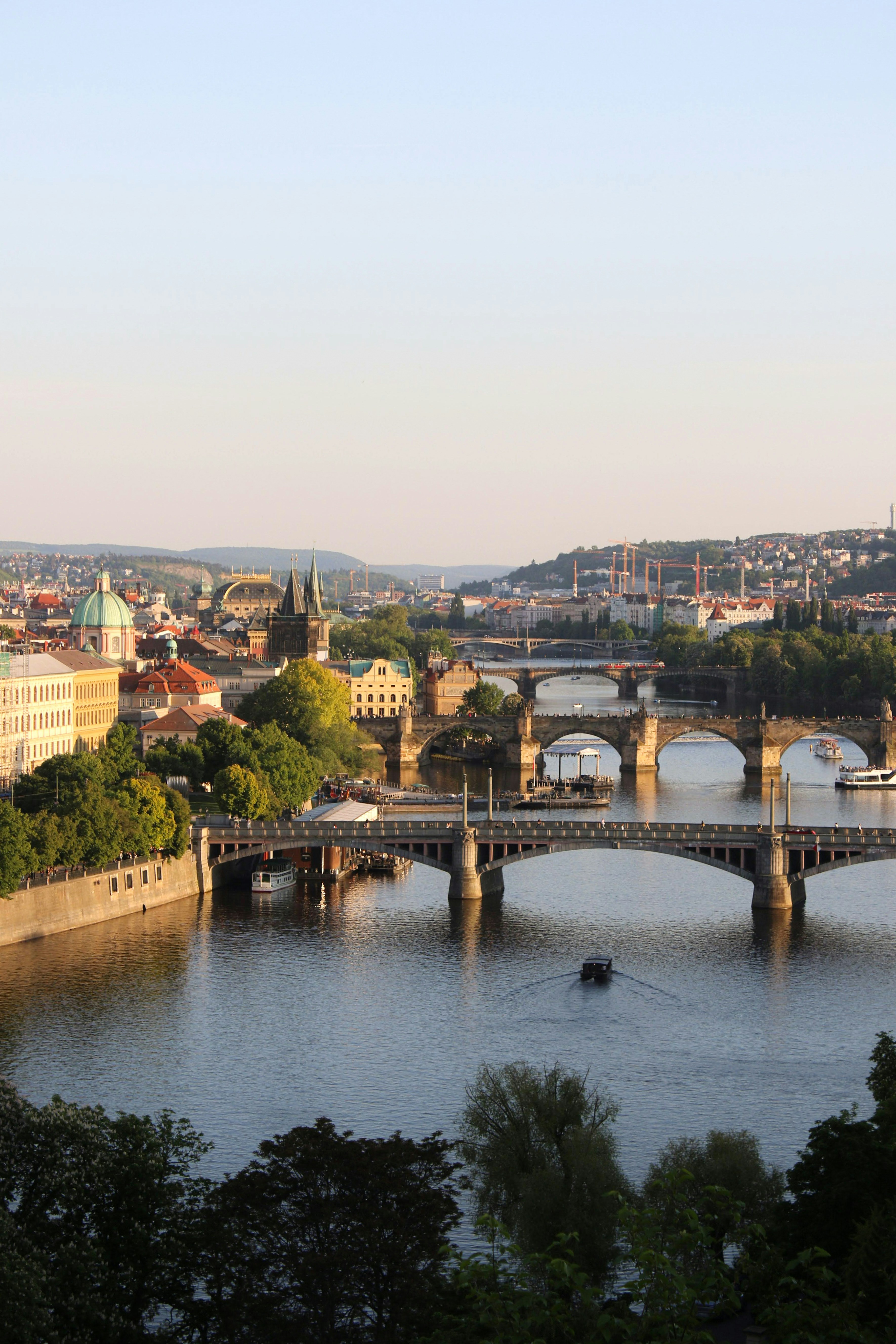 Bridges cross the river in a beautiful city view.