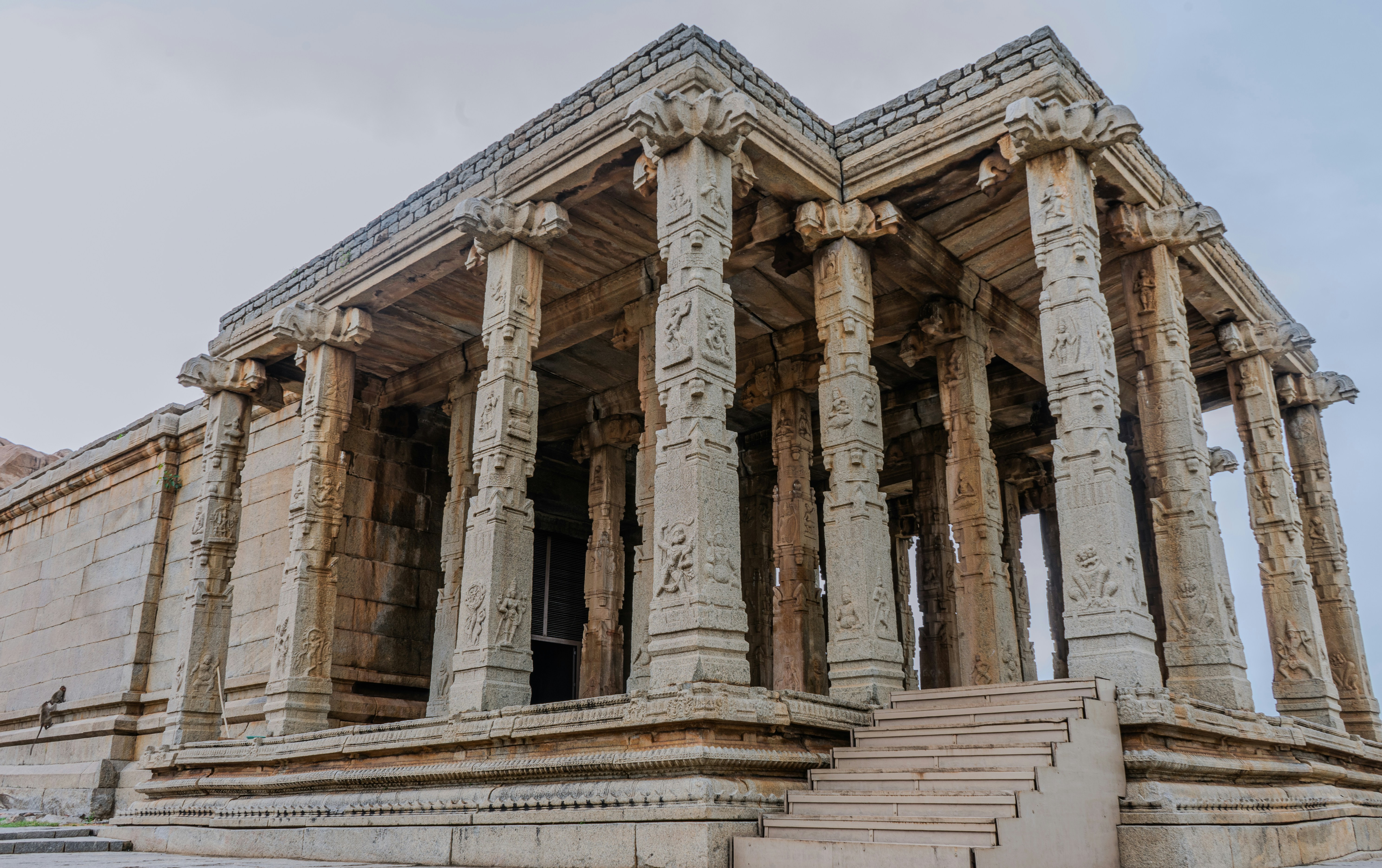 Ancient temple with ornate pillars stands.