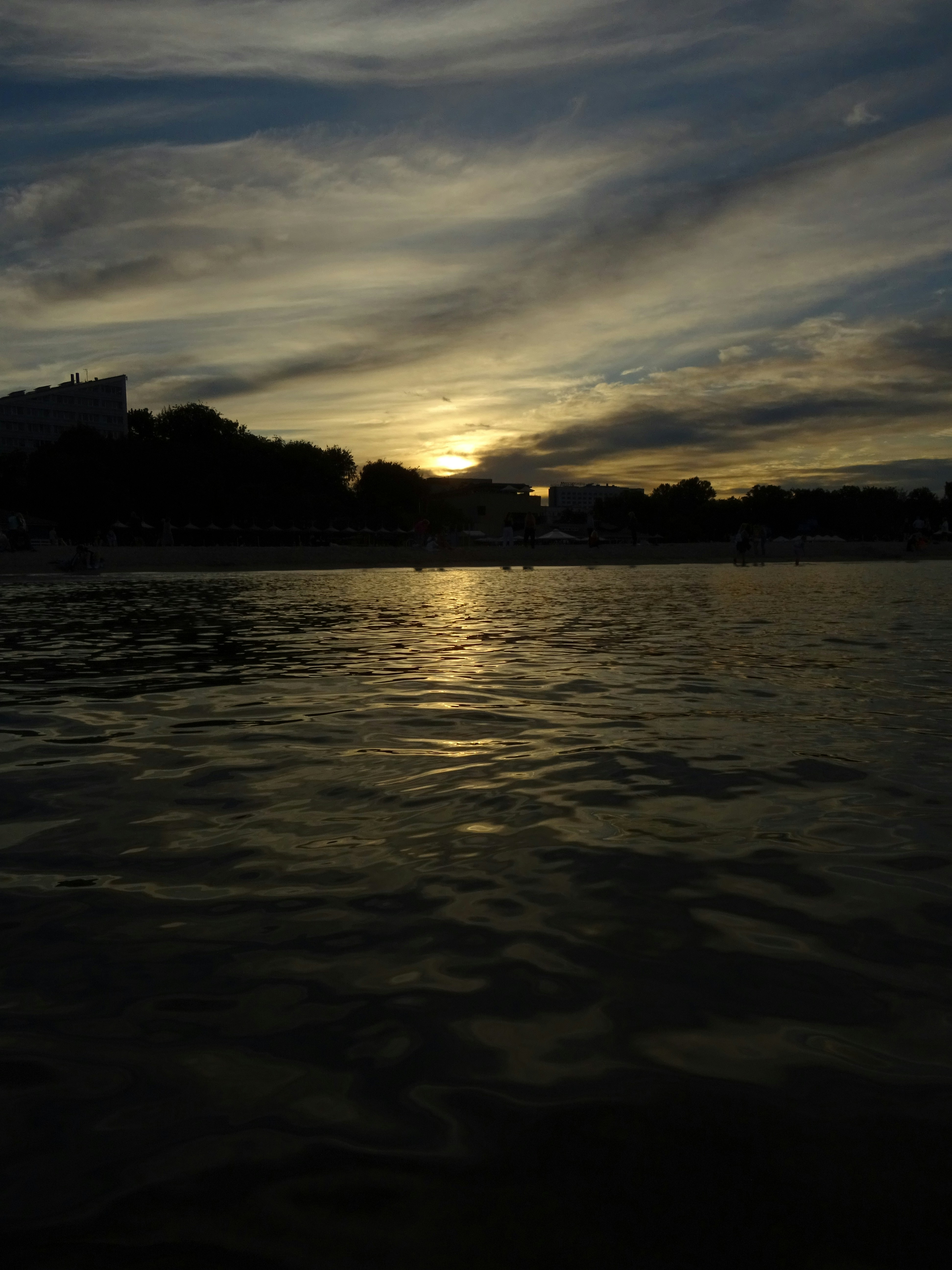 Sunset reflects beautifully on the water's surface.
