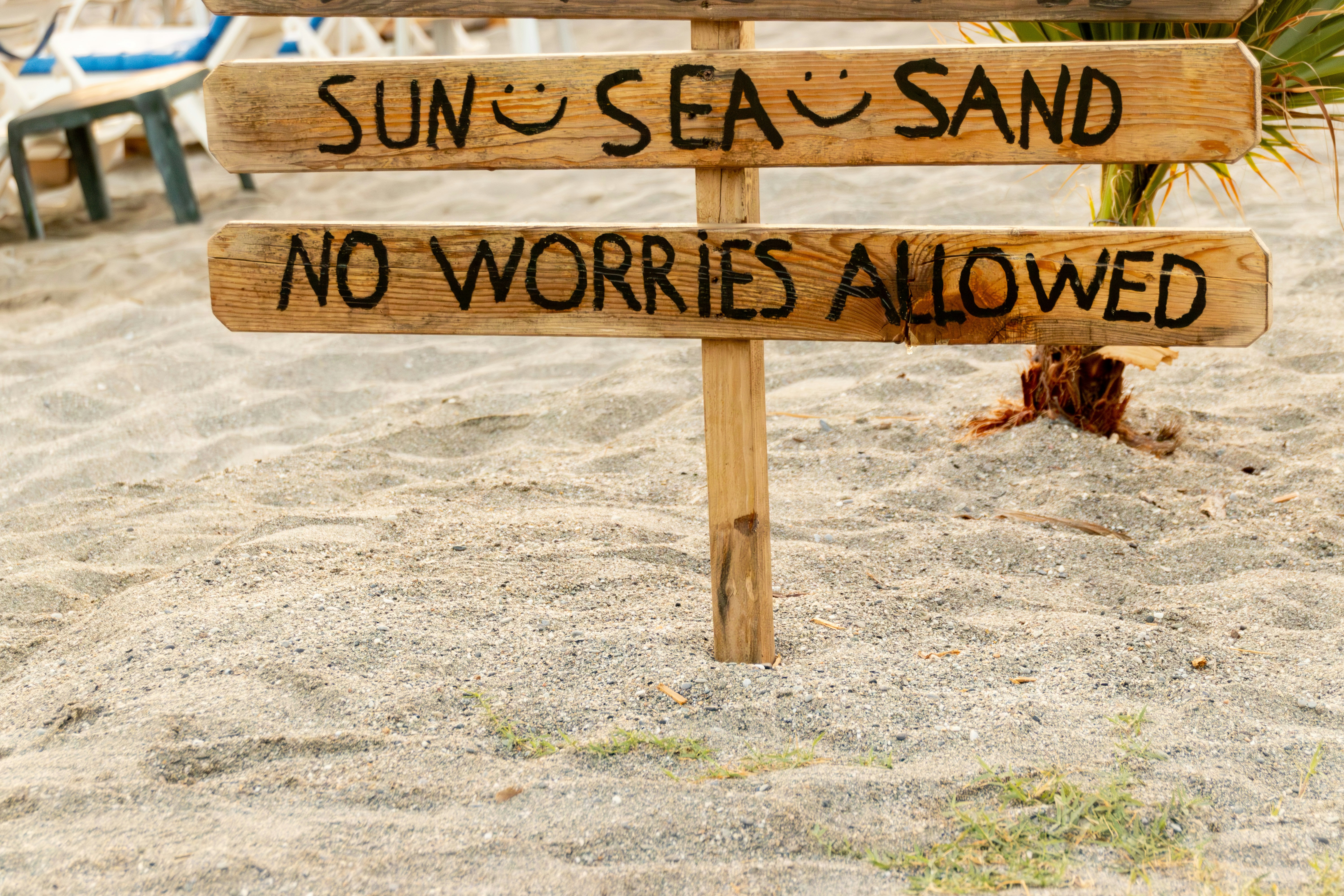 Beach sign | Sun, sea, sand: no worries allowed!