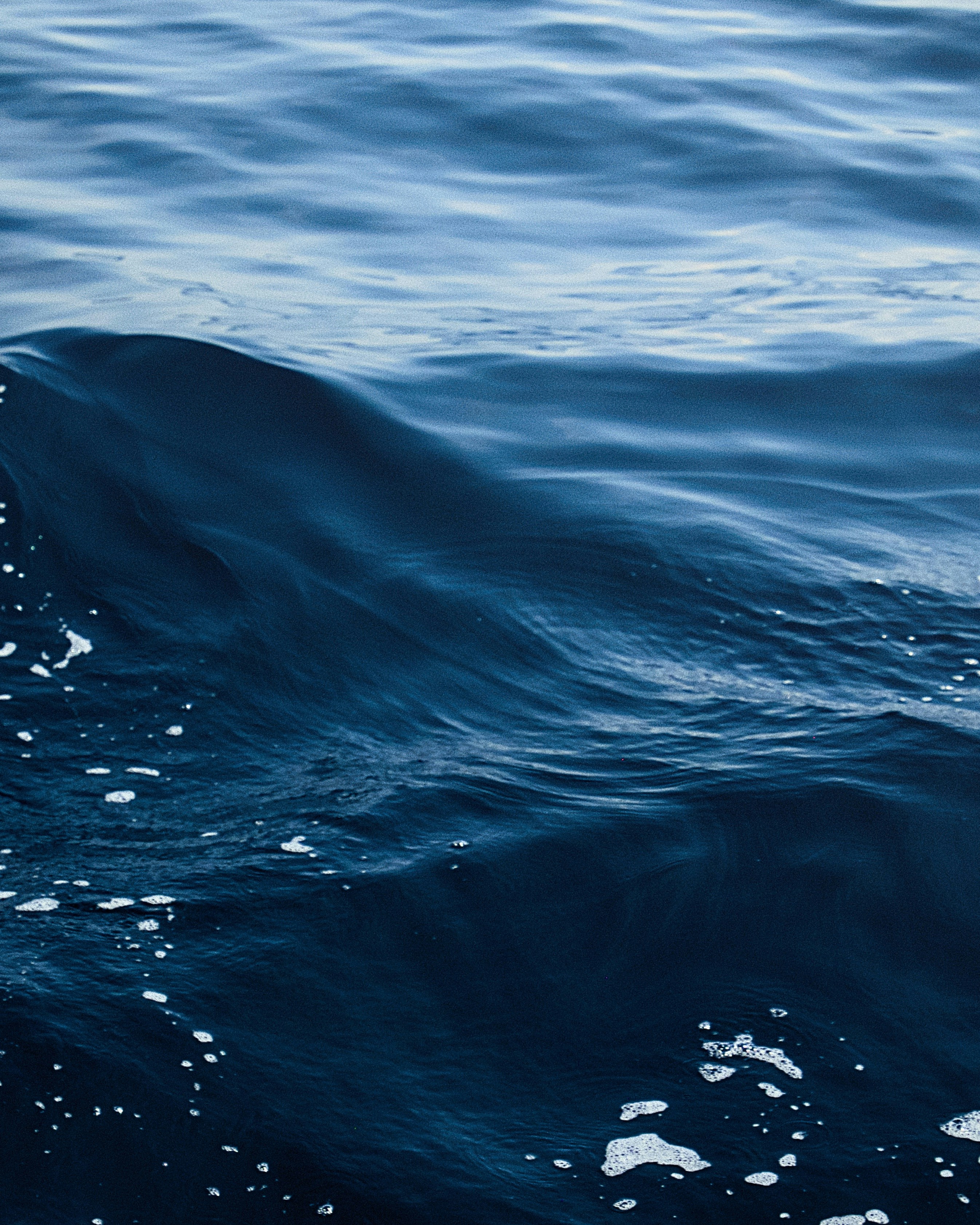 close up of seawater | Dark blue ocean water with subtle waves.