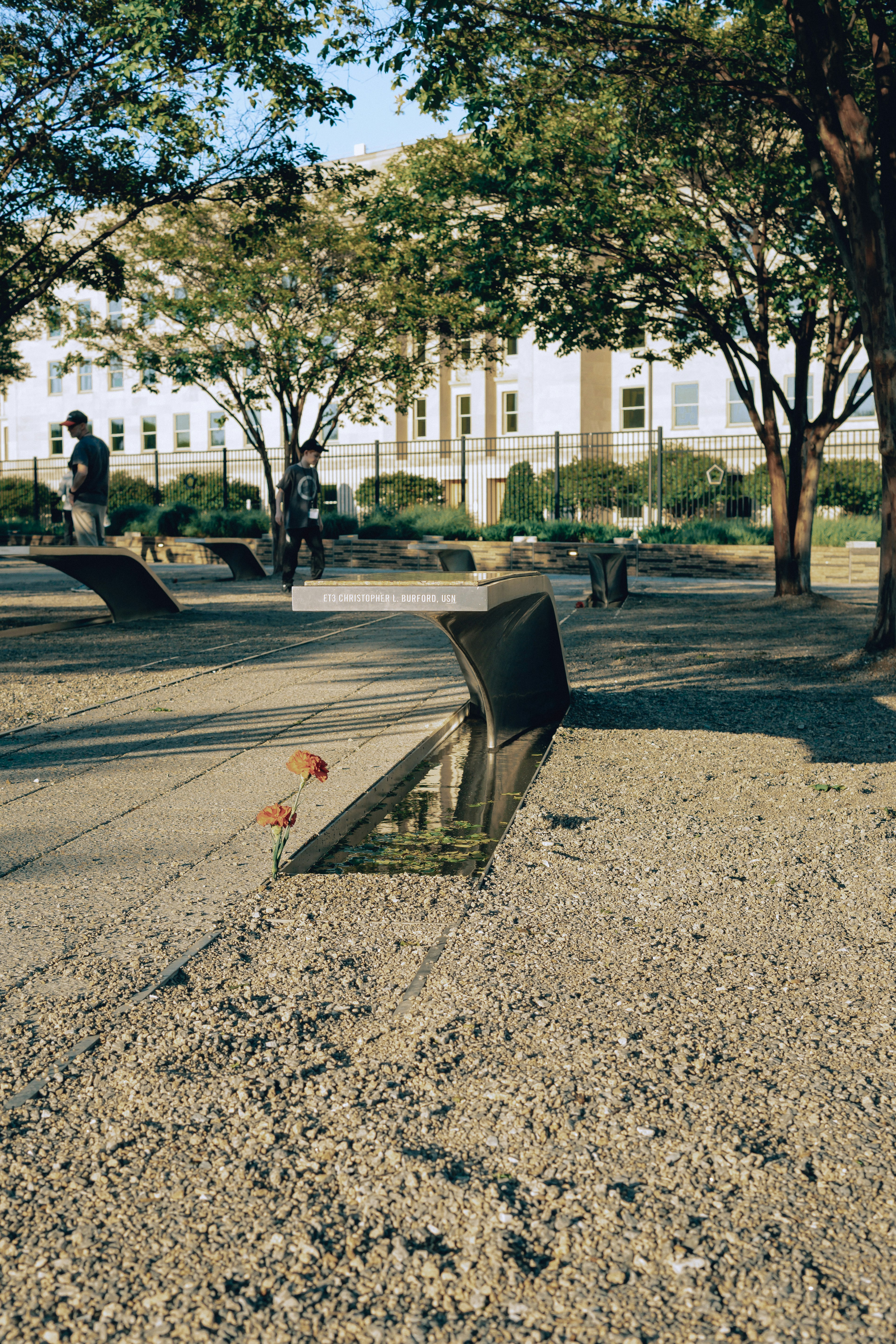 Memorial site with a water feature and trees.