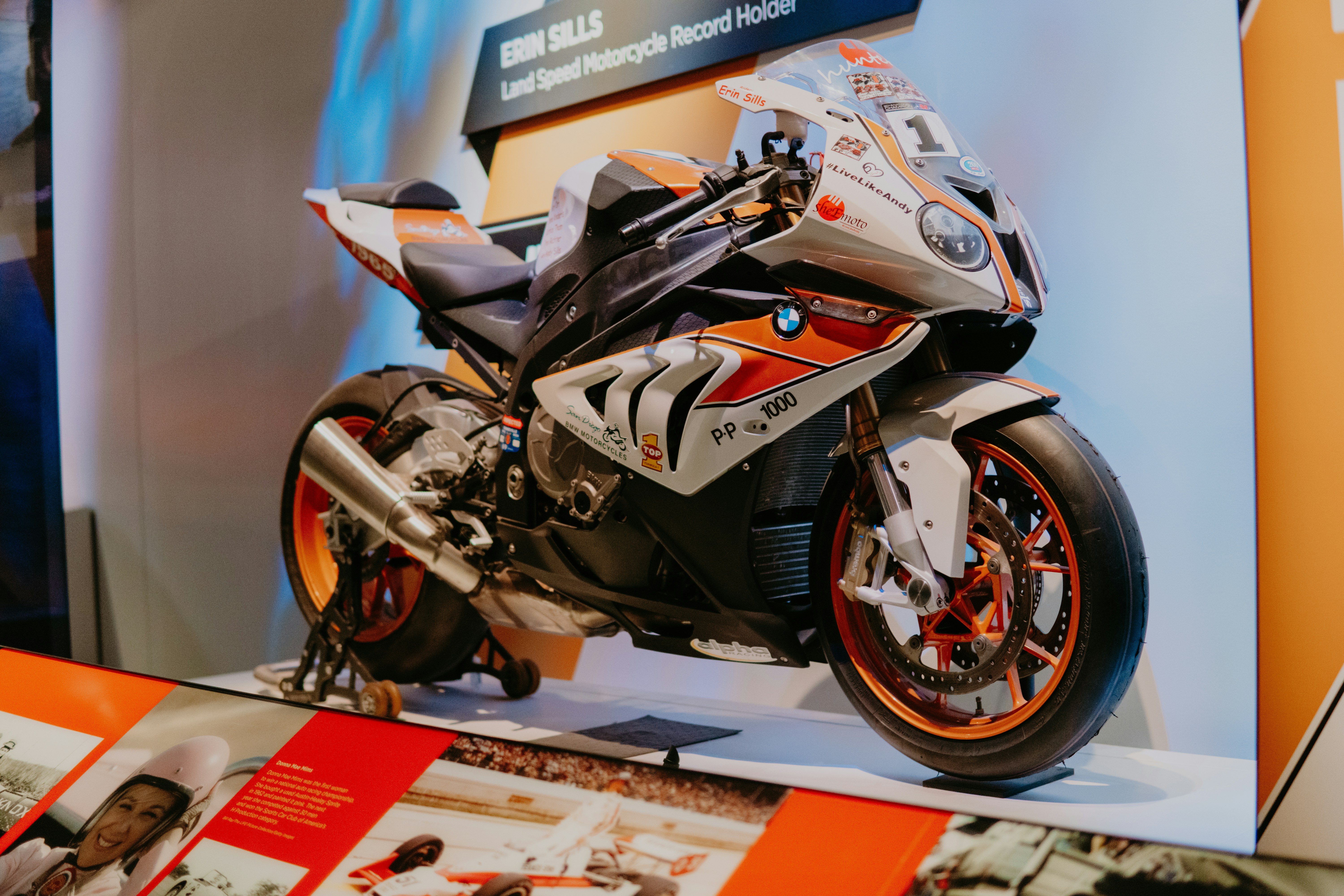 A BMW motorcycle is on display at an exhibit.