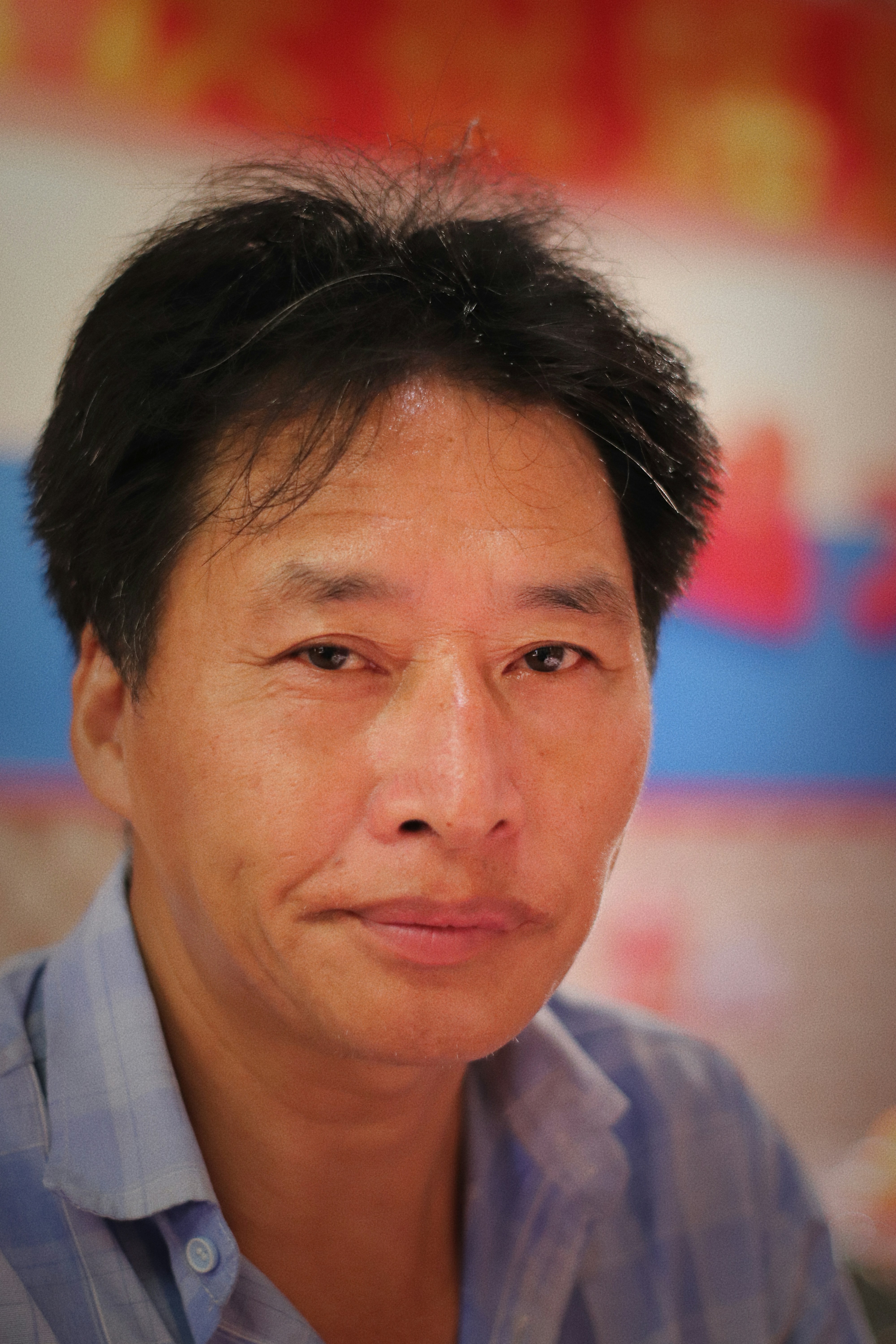 A man poses for a close-up portrait.